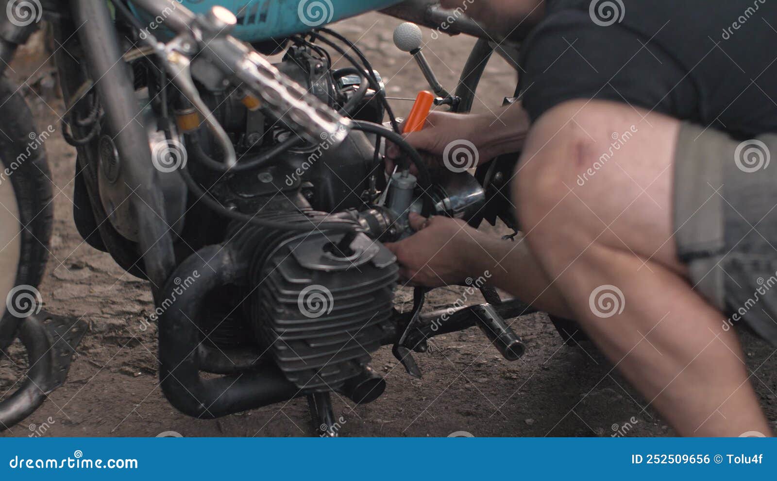 The Mechanic Man Tunes the Engine, Mechanic Fixes Old Motorcycle Engine ...