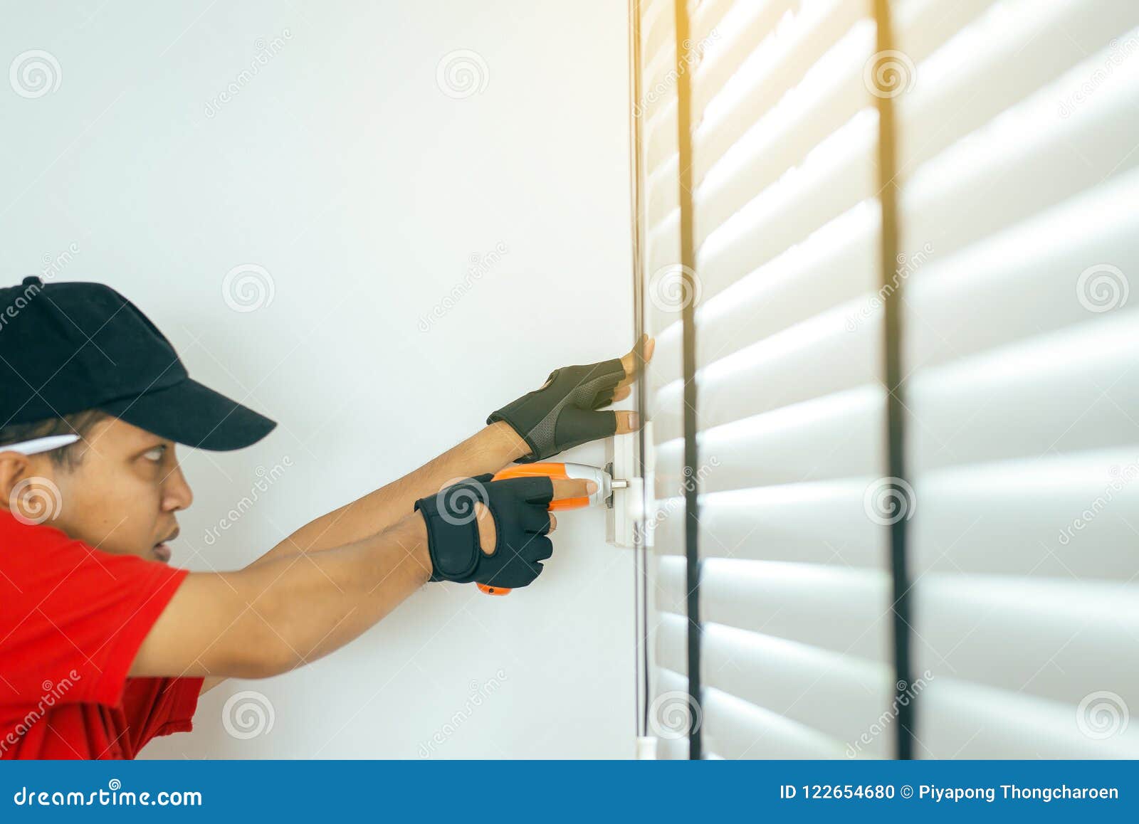 Mechanic Man Using Electric Drill Machine on the Wall Stock Photo ...