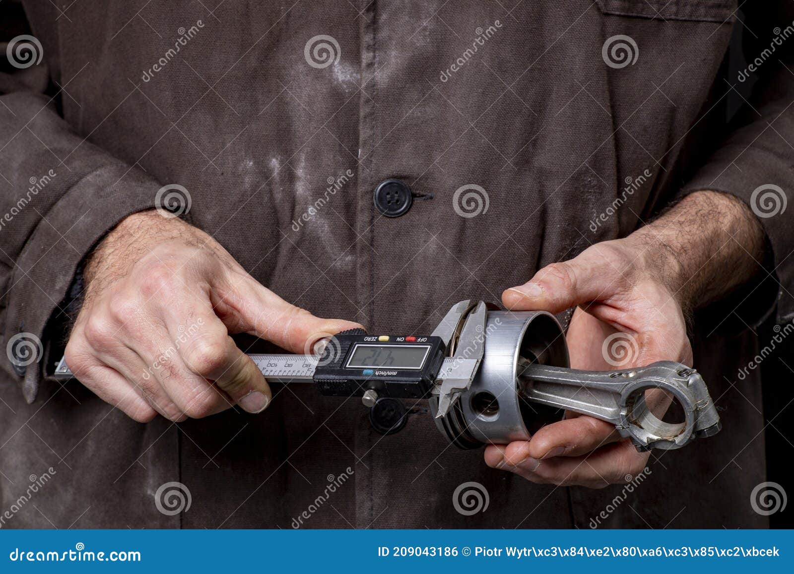 Mechanic Measuring Gears. Work In A Mechanical Workshop Royalty-Free ...