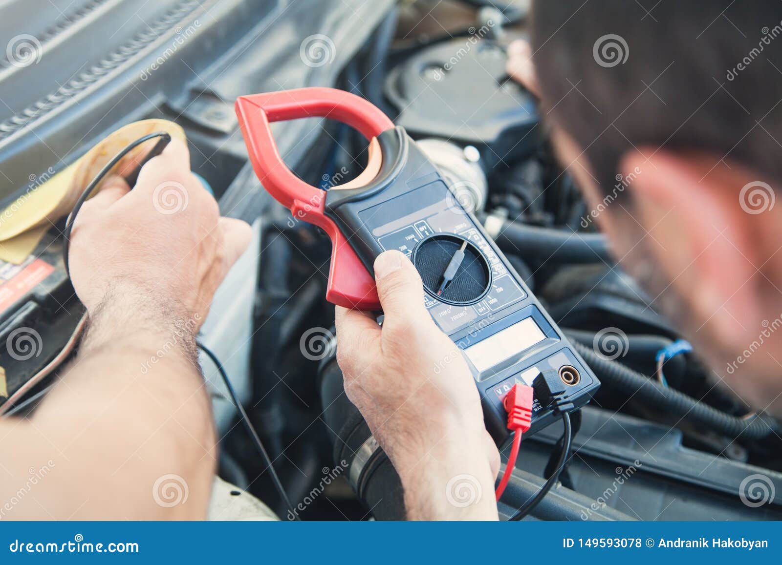 Mechanic with a Multimeter Testing Car Engine. Car Service Stock Photo ...