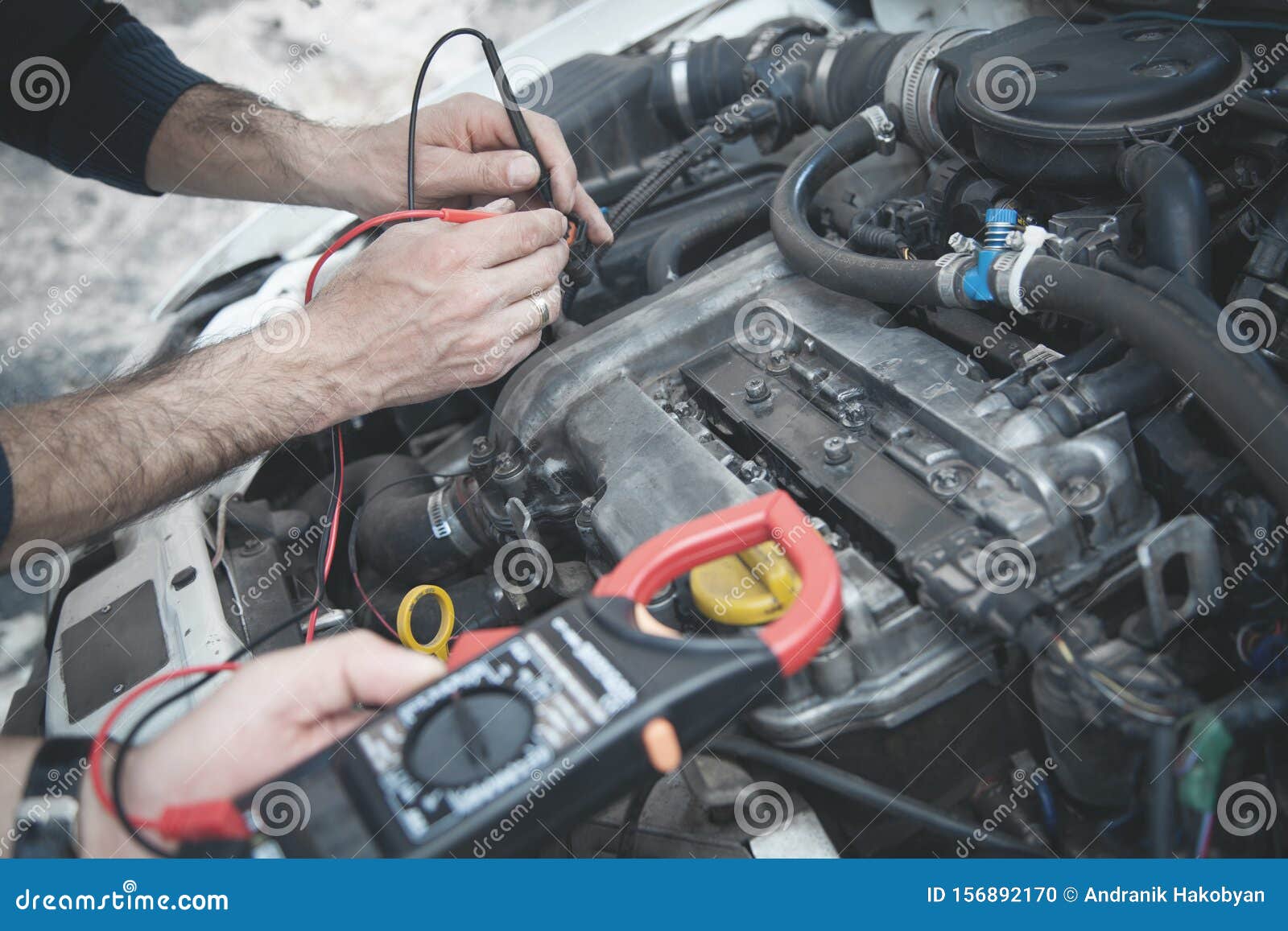Mechanic with a Multimeter Testing Car Engine. Car Service Stock Photo ...