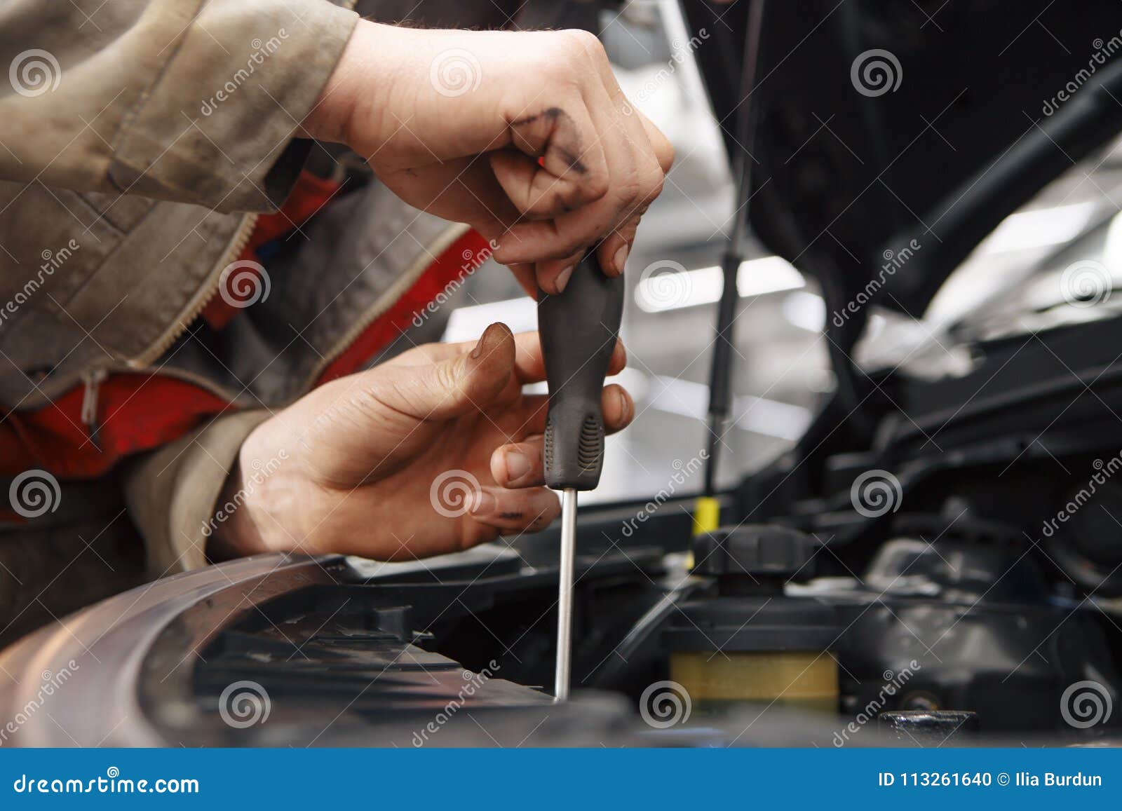 Mechanic with New Car Headlight in a Workshop Stock Photo - Image of ...