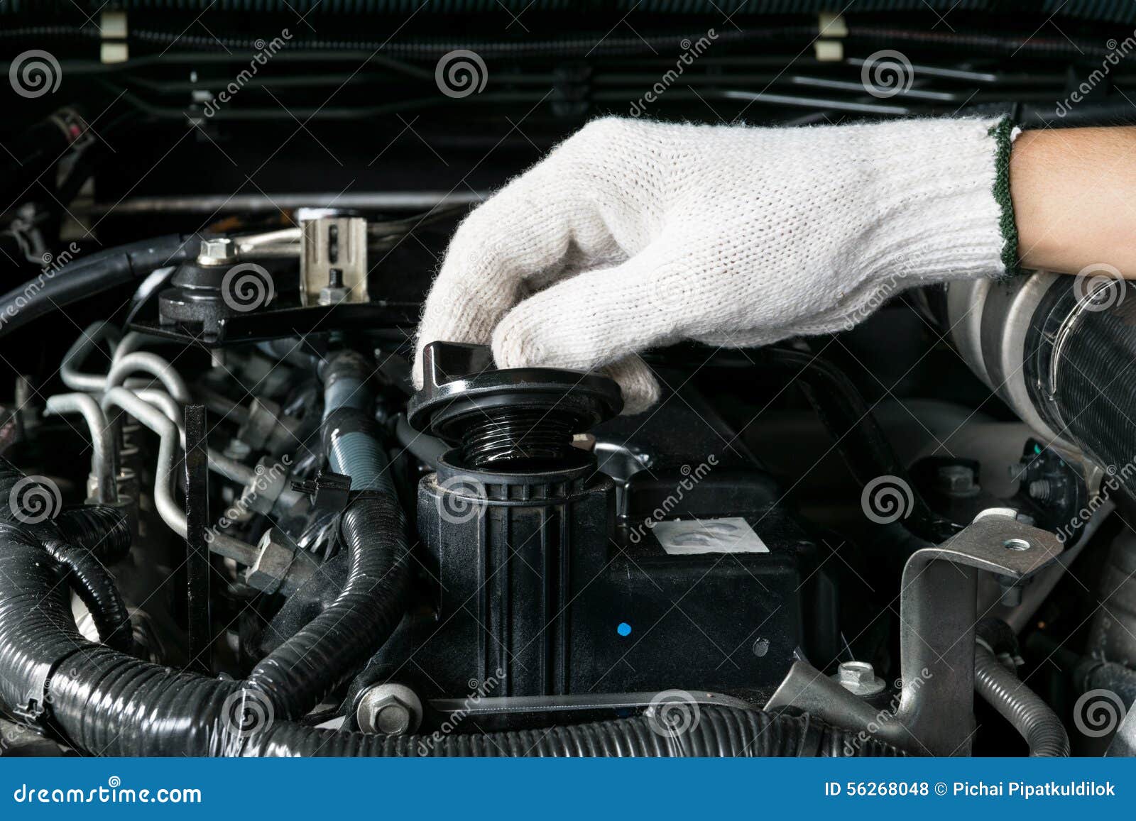 A Mechanic is Opening the Oil Cap from a Car Engine. Stock Photo ...