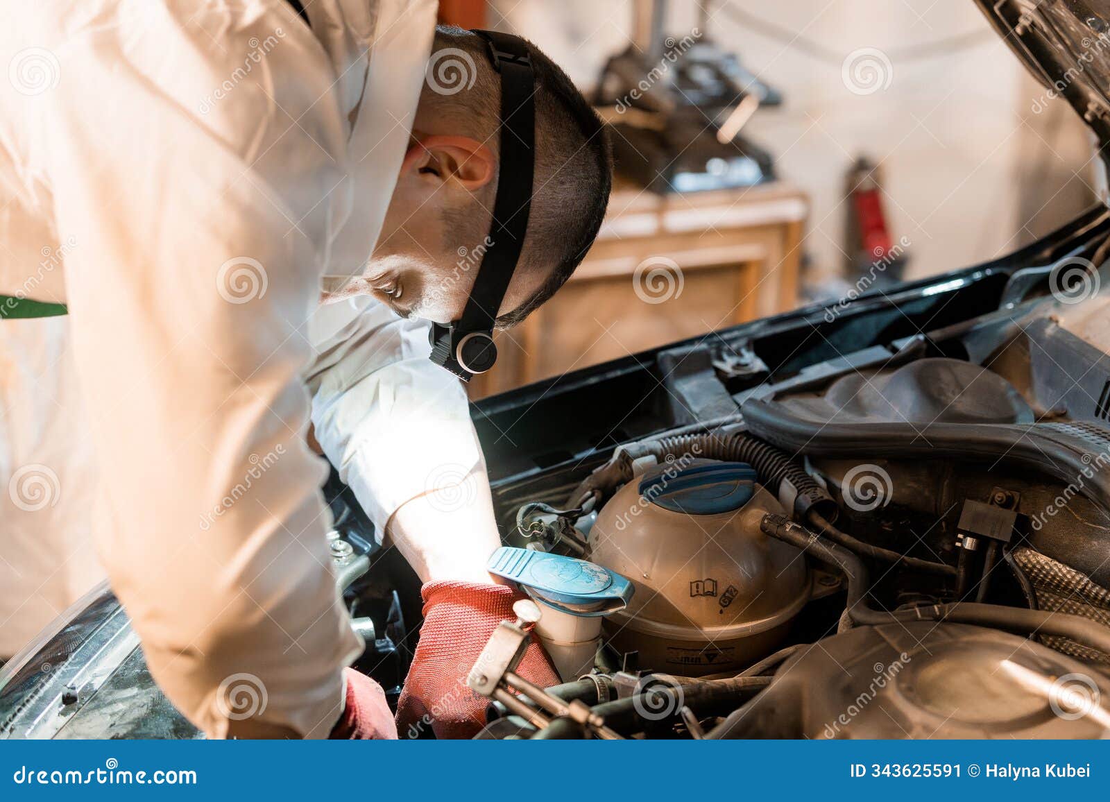 Mechanic Performing Engine Maintenance with Precision and Care Stock ...