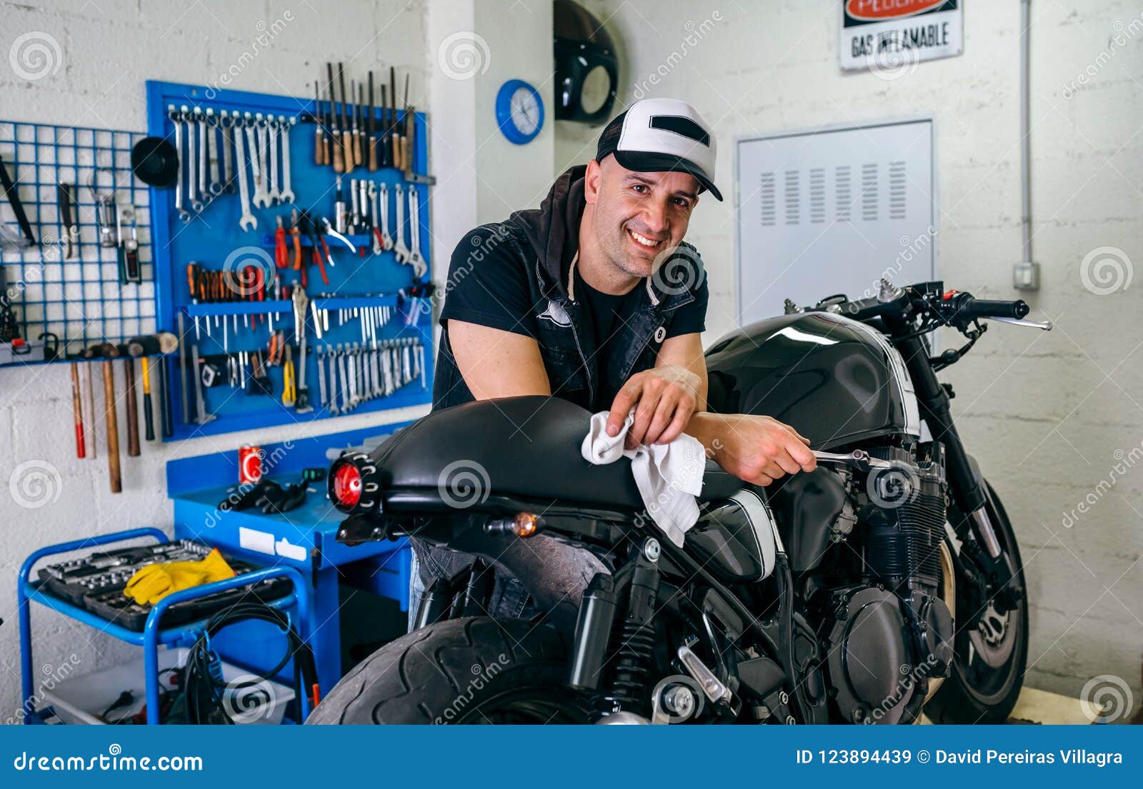 Mechanic Posing with a Motorcycle Stock Image - Image of people, fixing ...