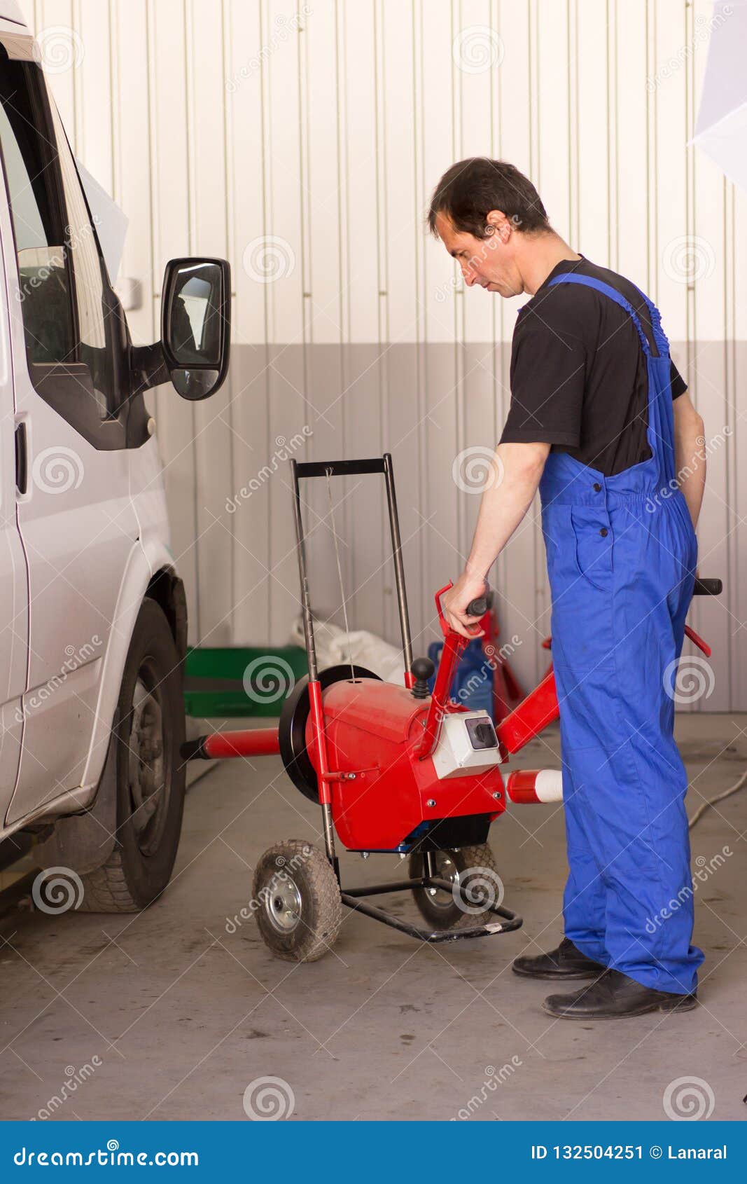 Mechanic is Pumping Up Wheels in Service Station Stock Image - Image of ...