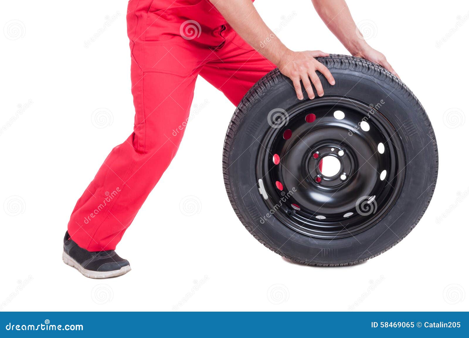 Mechanic Pushing Car Wheel on White Background Stock Image - Image of ...