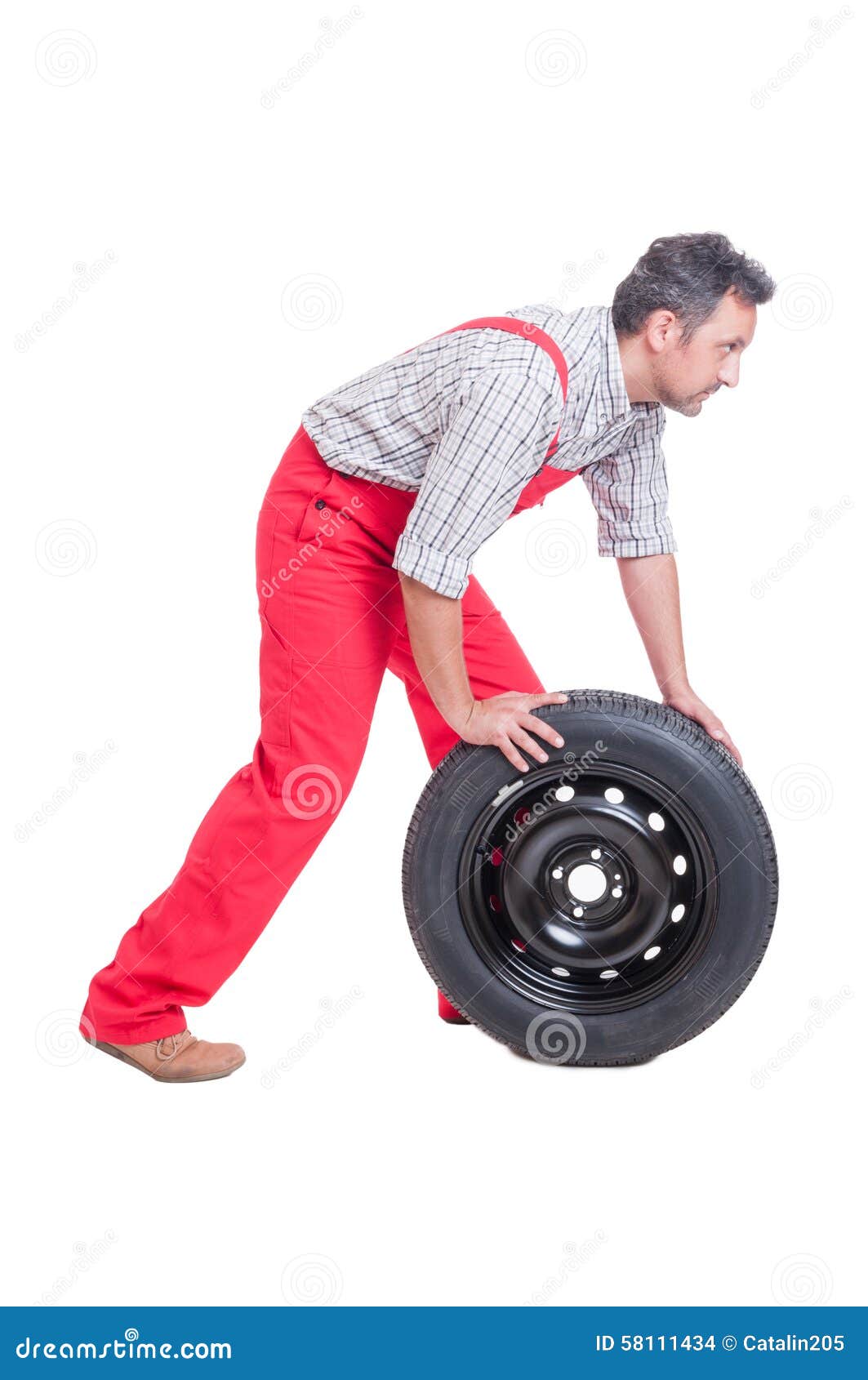 Mechanic Pushing a New Car Wheel Stock Photo - Image of service, auto ...