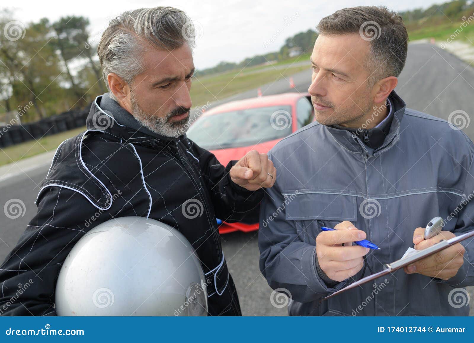 Mechanic with Red Racing Car Stock Photo - Image of open, male: 174012744