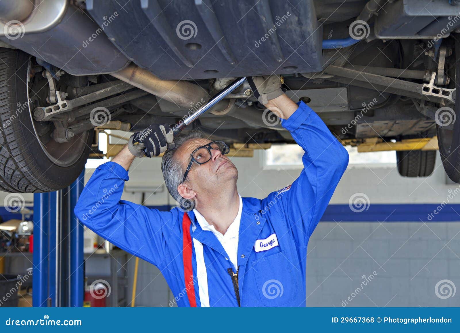 Mechanic Repairing the Car with a Monkey Wrench Stock Photo - Image of ...
