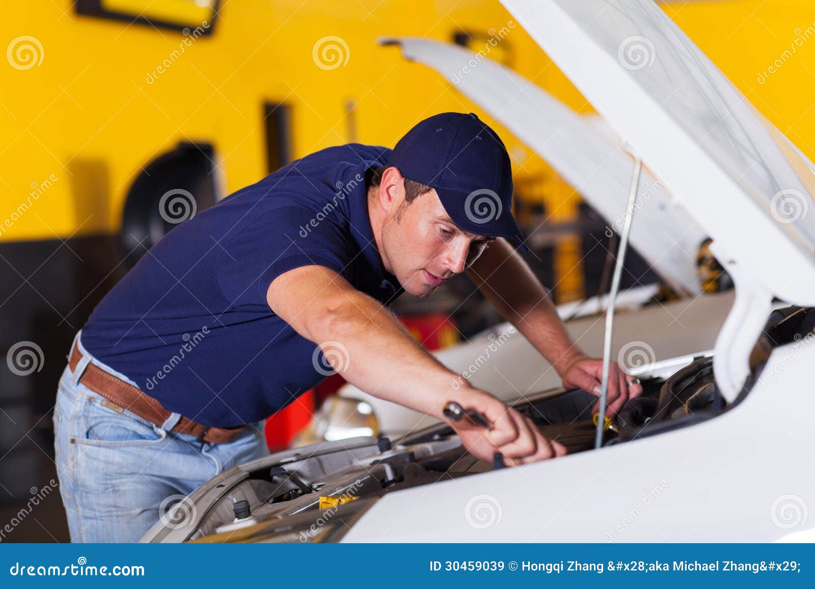 Mechanic repairing vehicle stock image. Image of employee - 30459039