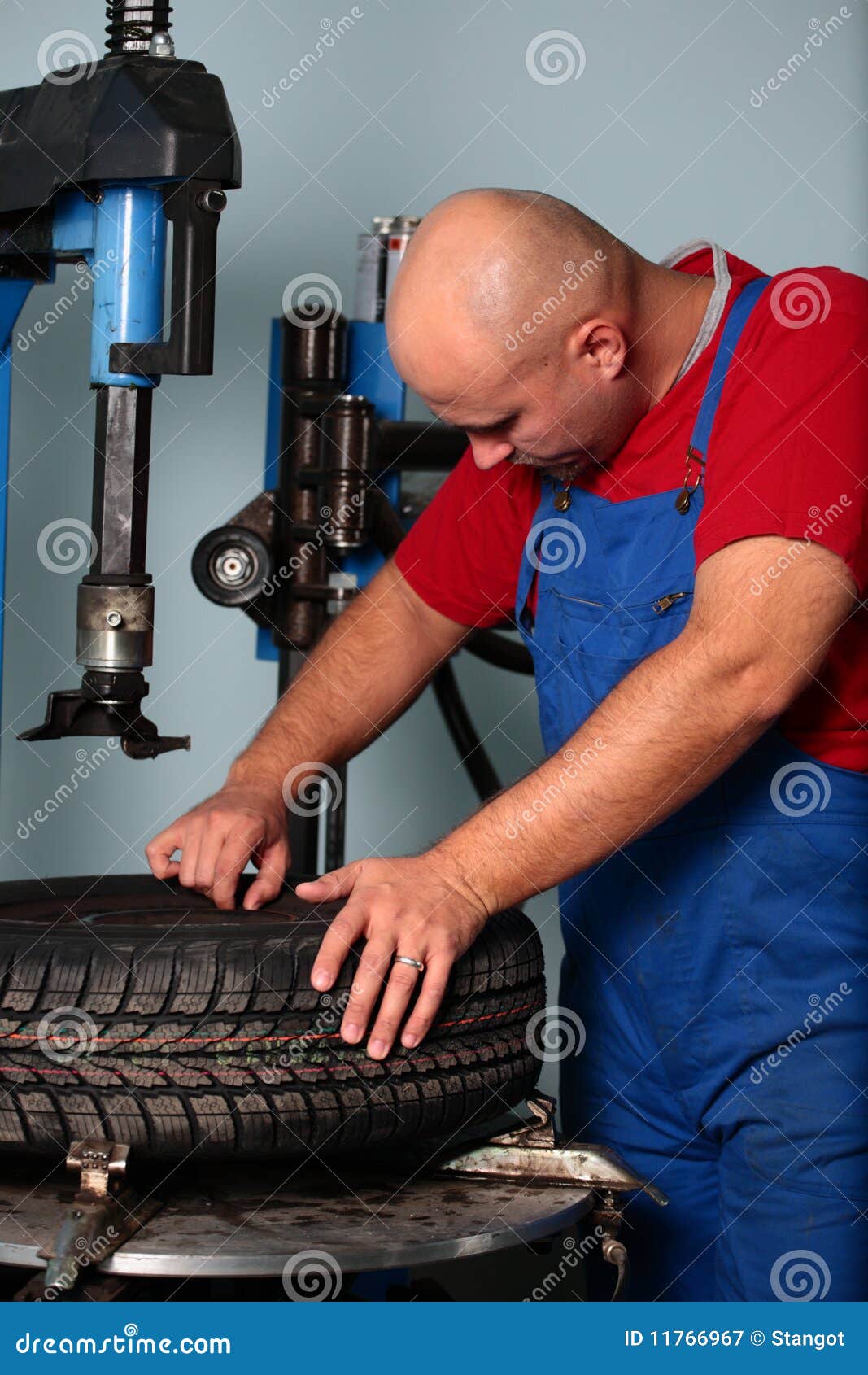 Mechanic repairs tire stock image. Image of closeup, occupation - 11766967