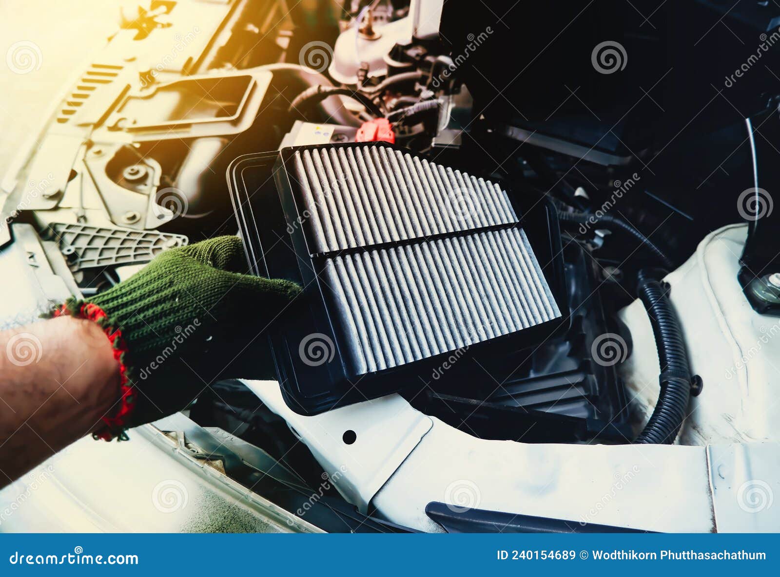 A Mechanic is Replacing an Air Filter in the Engine Car Filter Socket ...