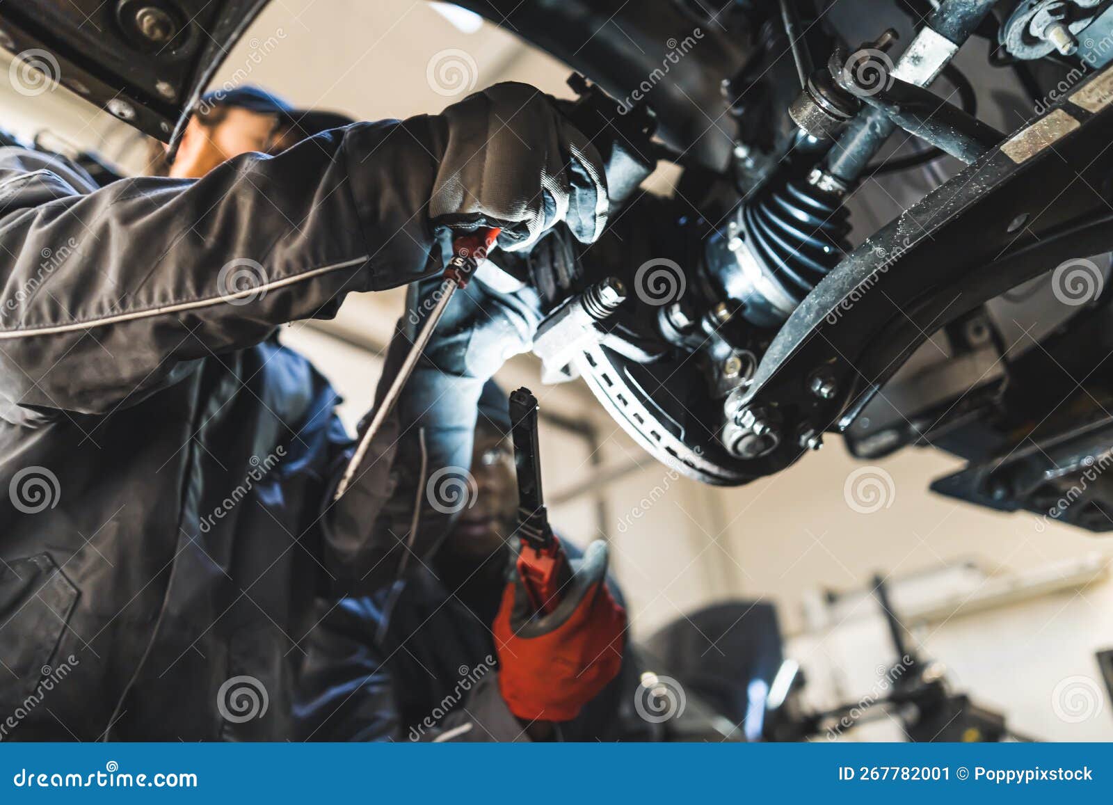 Mechanic Replacing Car Wheel Using Different Modern Tools in Car Repair ...