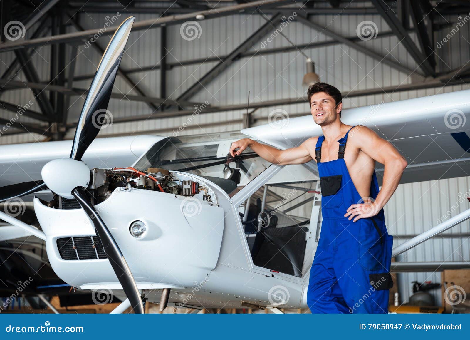 Mechanic Resting in Front of the Plane in a Shed Stock Image - Image of ...