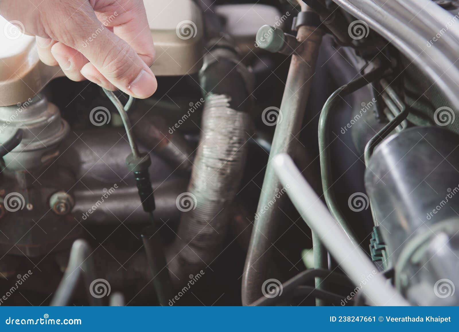 Mechanic`s Hand Checking Engine Oil Level in a Mechanical Workshop ...