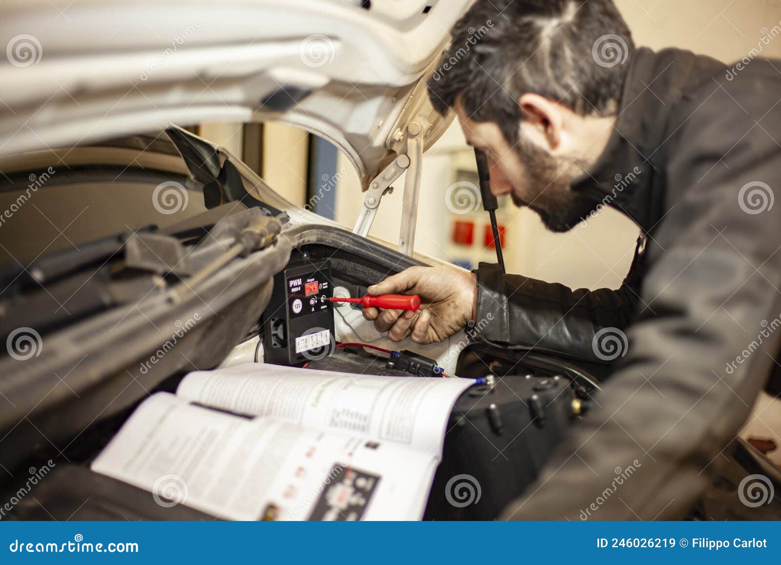Mechanic`s Hands Adjust the Hydrogen System Control Unit in the Car ...