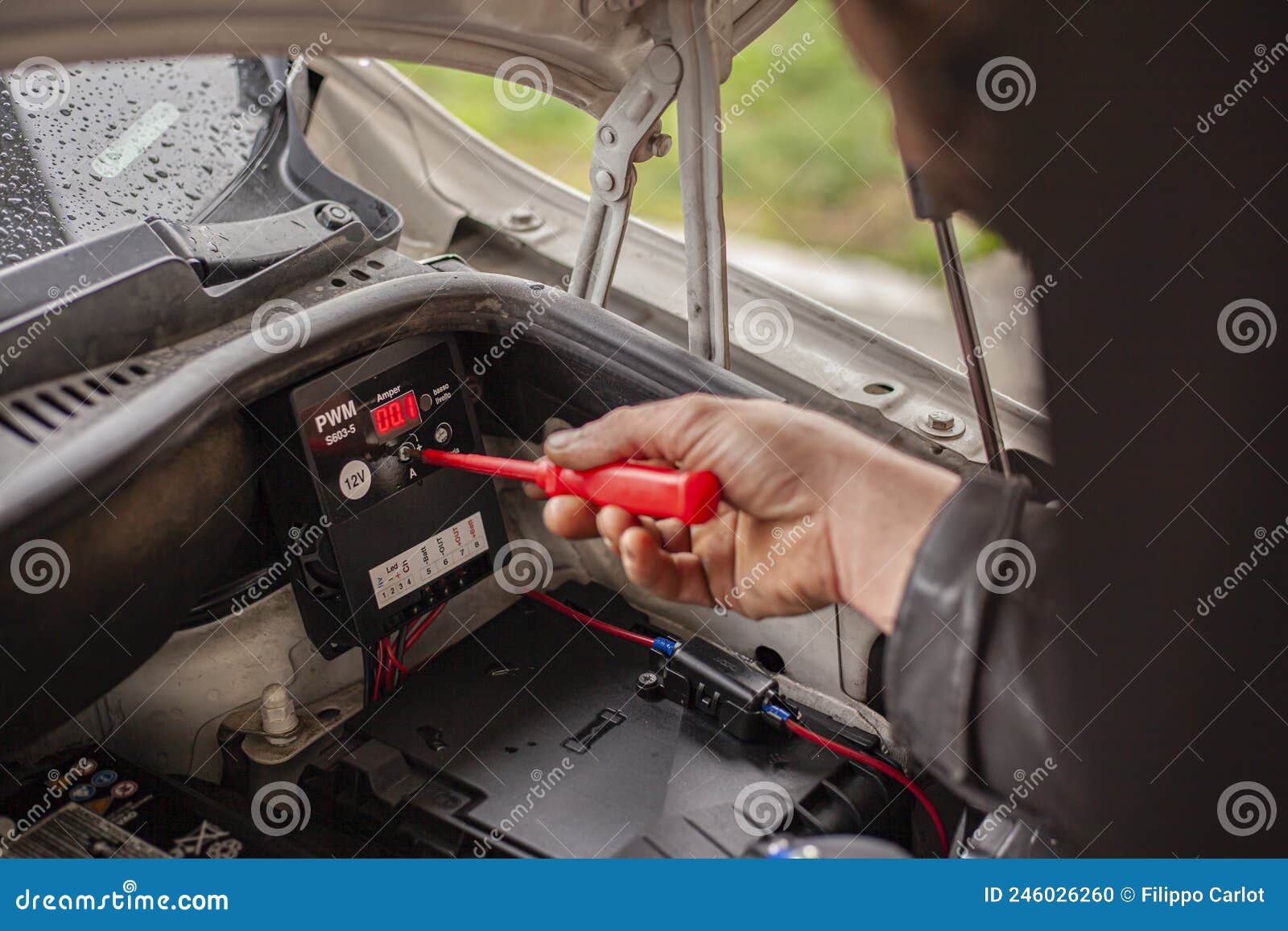 Mechanic`s Hands Adjust the Hydrogen System Control Unit in the Car ...