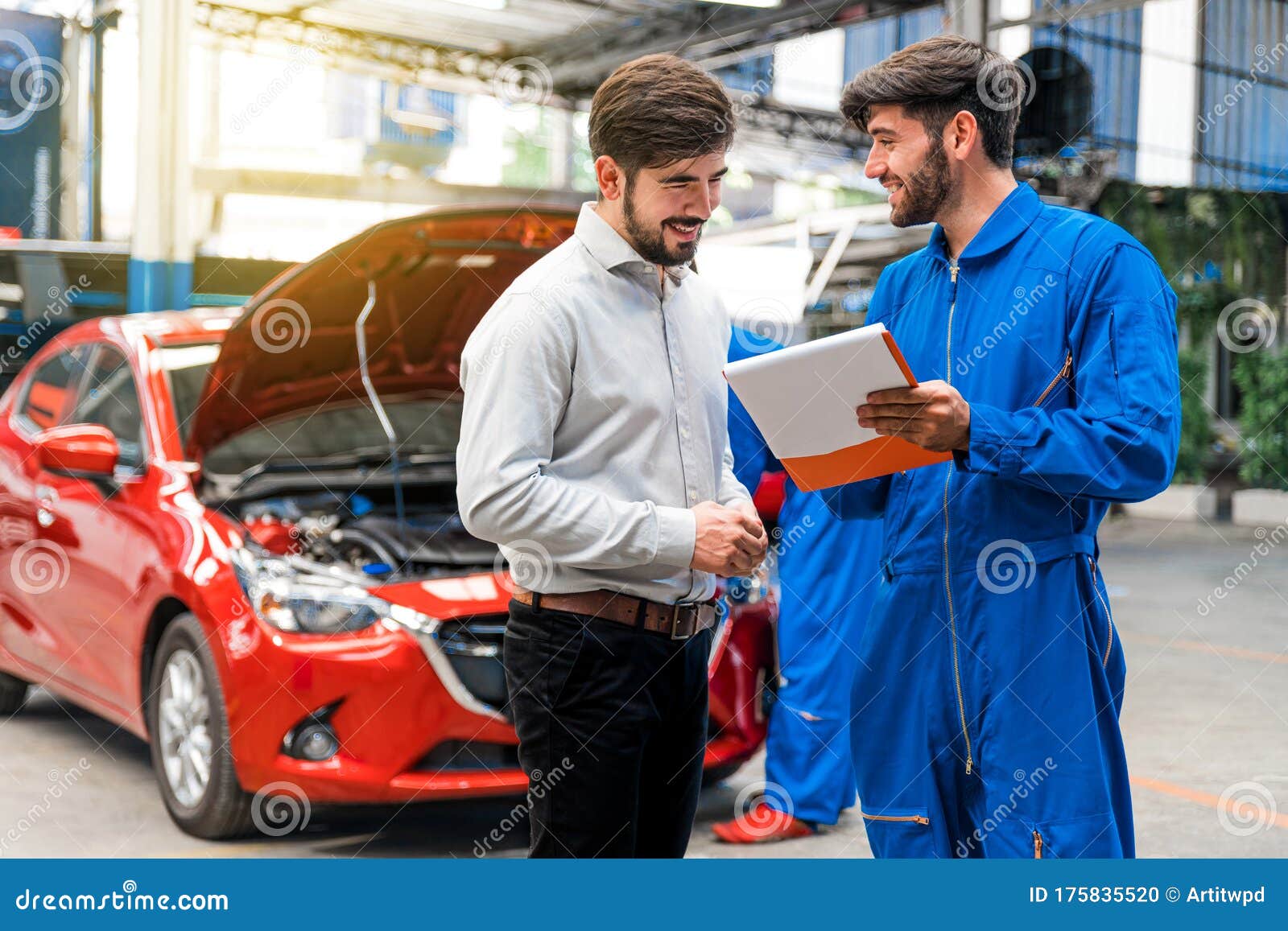 Mechanic Show the Car Checking List for Customer with Blur His ...