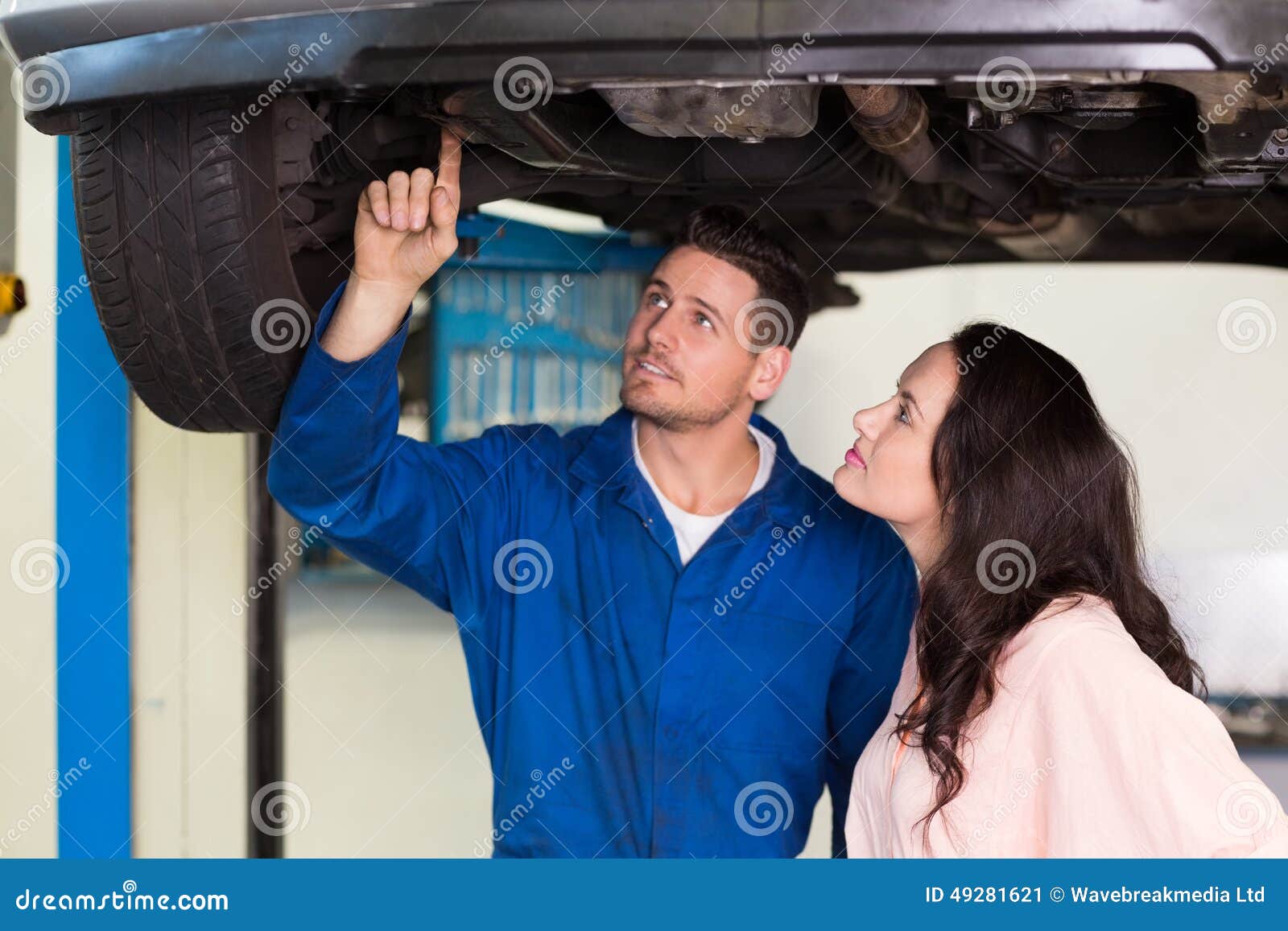 Mechanic Showing Customer The Problem With Car Stock Photo - Image ...