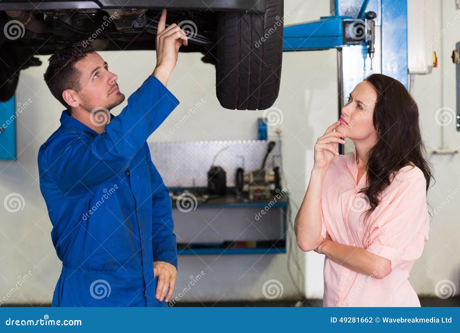 Mechanic Showing Customer the Problem with Car Stock Photo - Image of ...