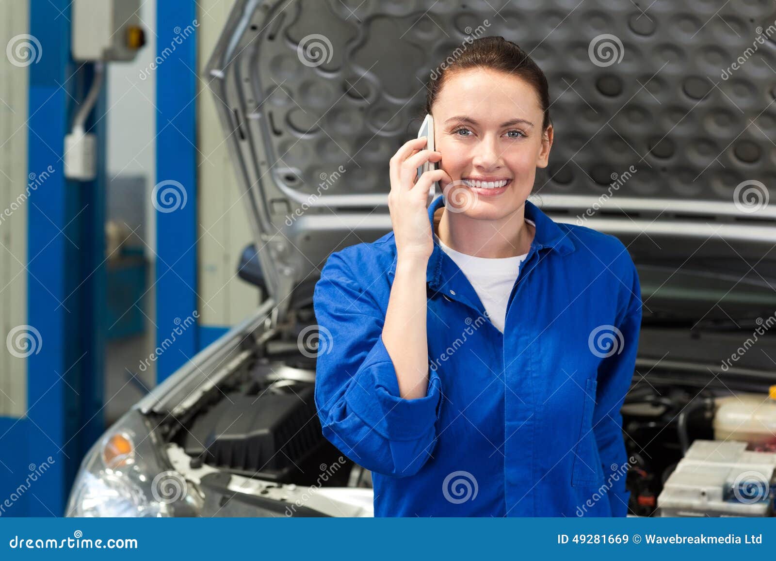 Mechanic Smiling at the Camera on the Phone Stock Image - Image of hood ...
