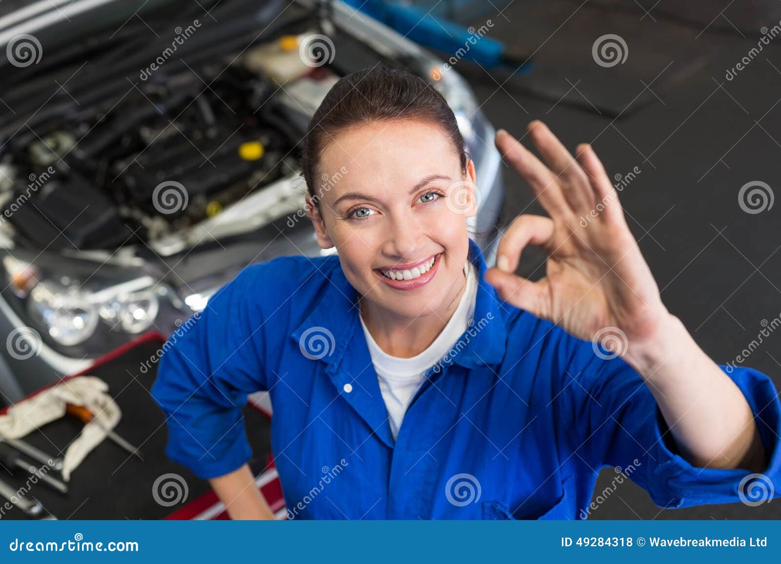 Mechanic Smiling Up at Camera Stock Photo - Image of positive ...