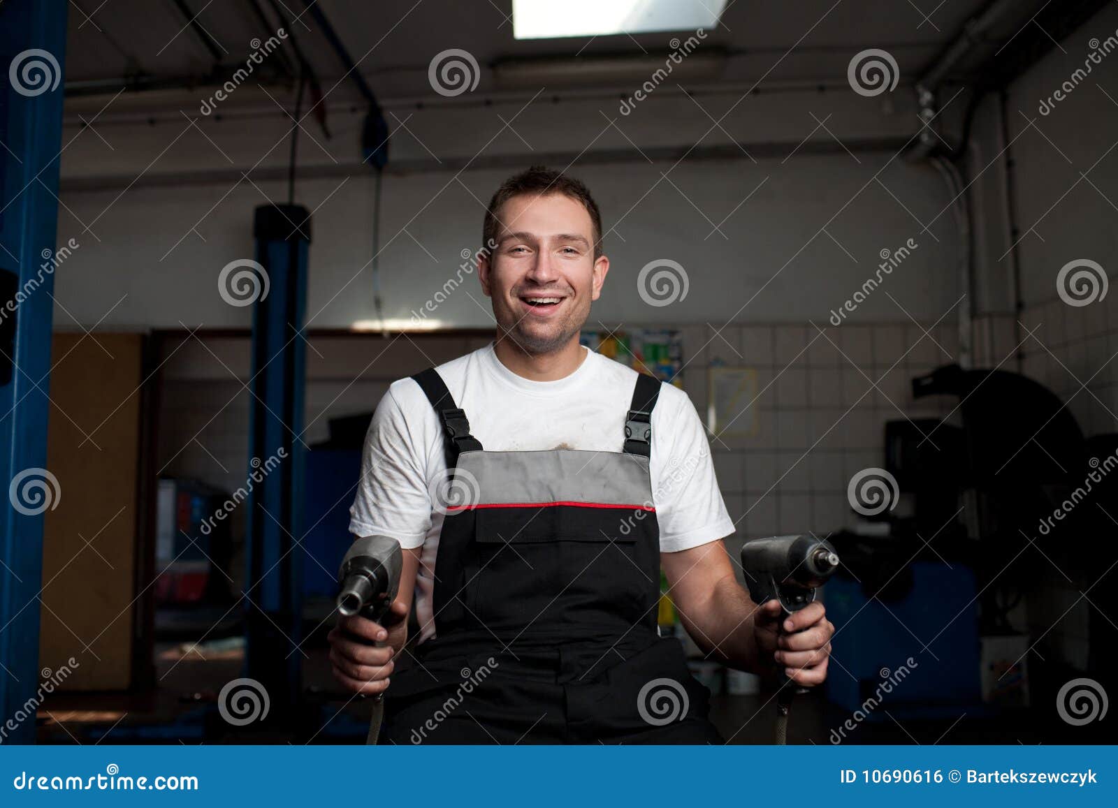 Mechanic smiling at work stock photo. Image of maintenance - 10690616