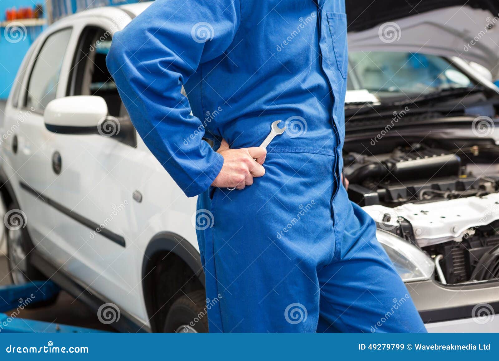 Mechanic with Spanner by Car Stock Image - Image of adult, manual: 49279799