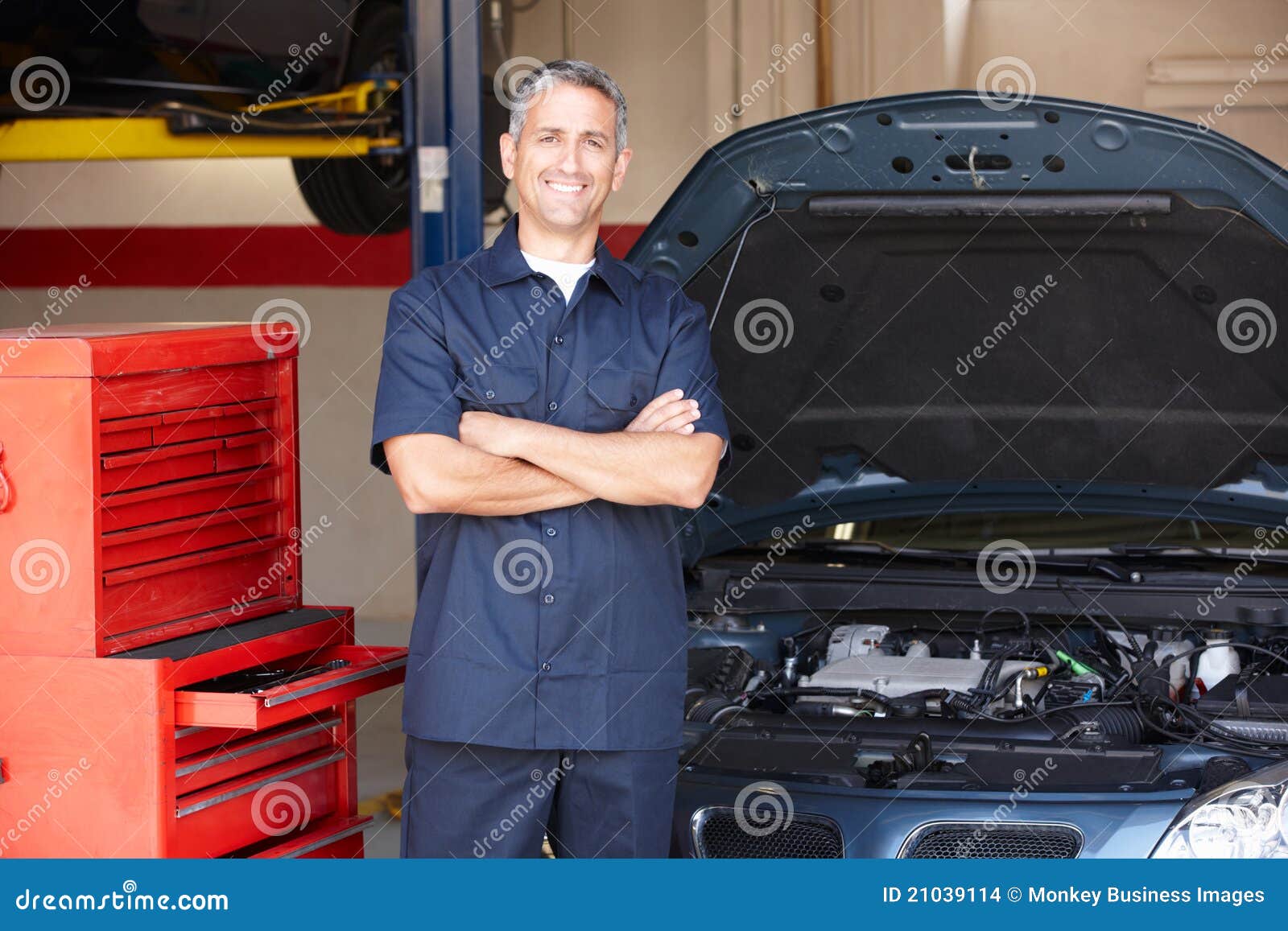 Mechanic Standing in Front of Car Stock Photo - Image of business ...