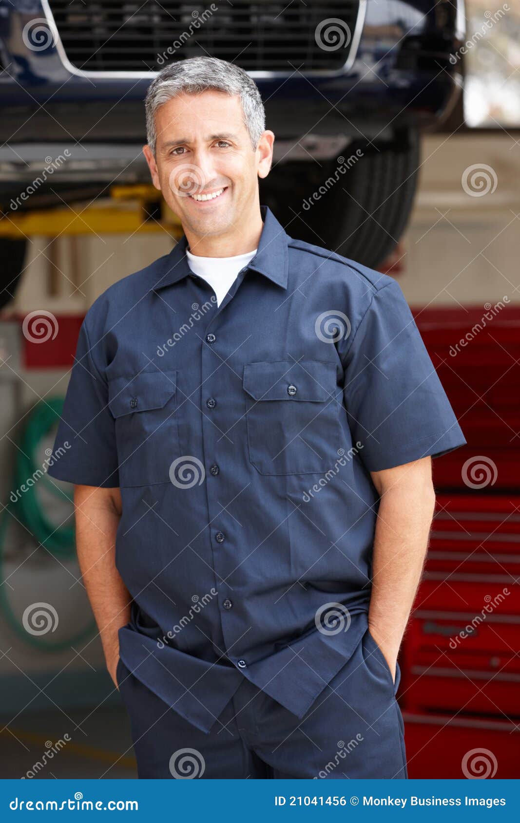 Mechanic Standing in Front of Car Stock Photo - Image of confident ...