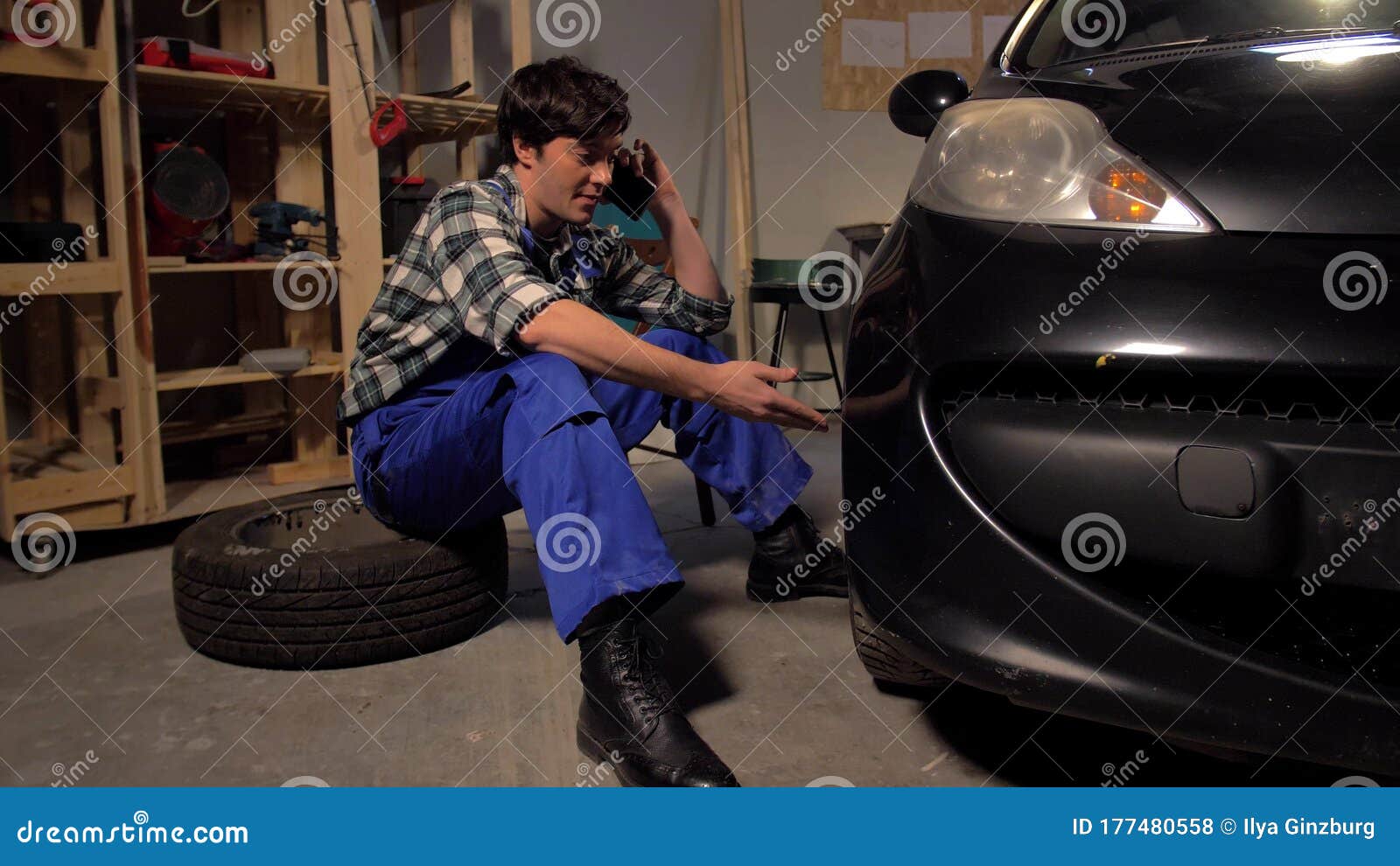 Mechanic Talking on the Phone Stock Photo - Image of garage, male ...
