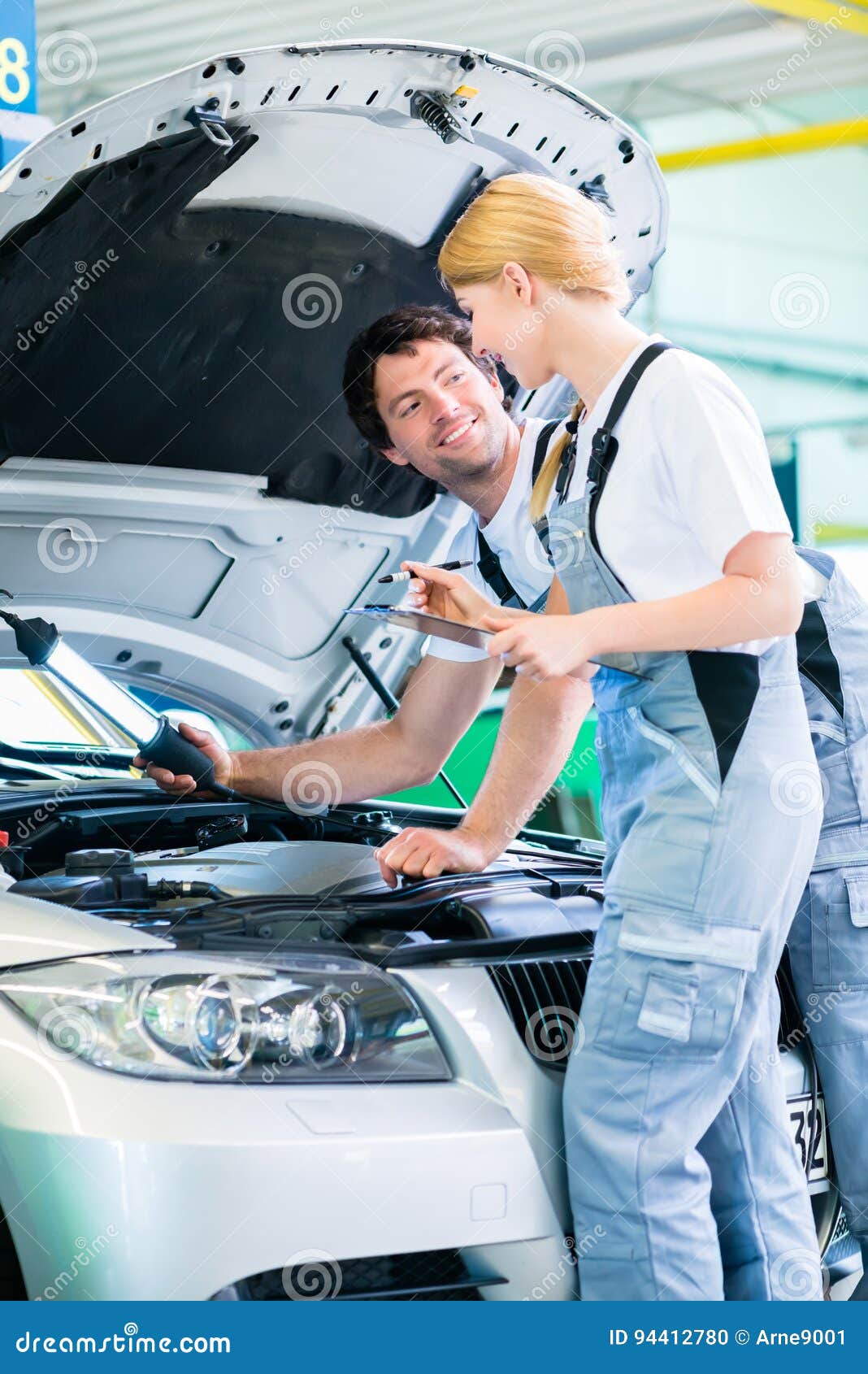 Mechanic Team Working in Car Workshop Stock Photo - Image of technician ...