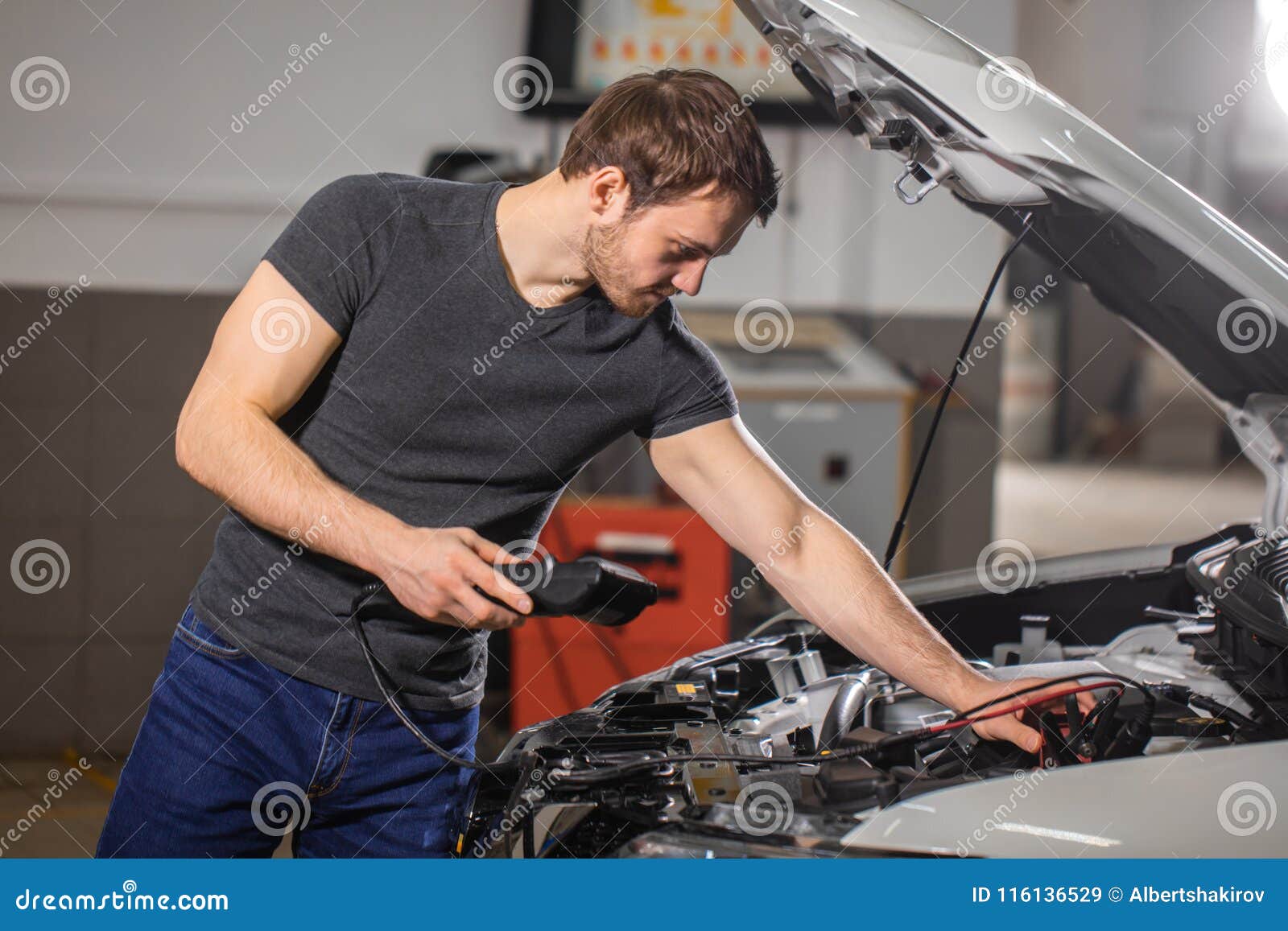 Mechanic Testing Electrical System on Automobile Stock Image - Image of ...