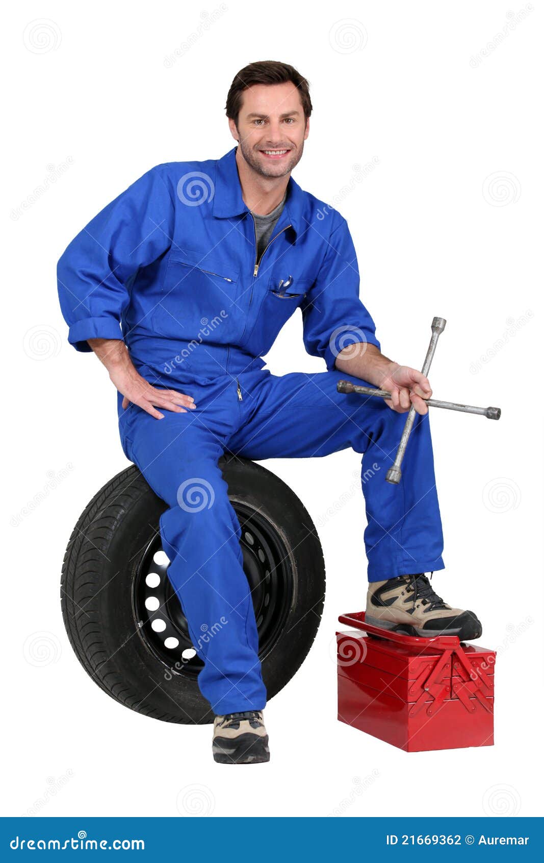 Mechanic with Tyre and Tools Stock Photo - Image of garage, handsome ...