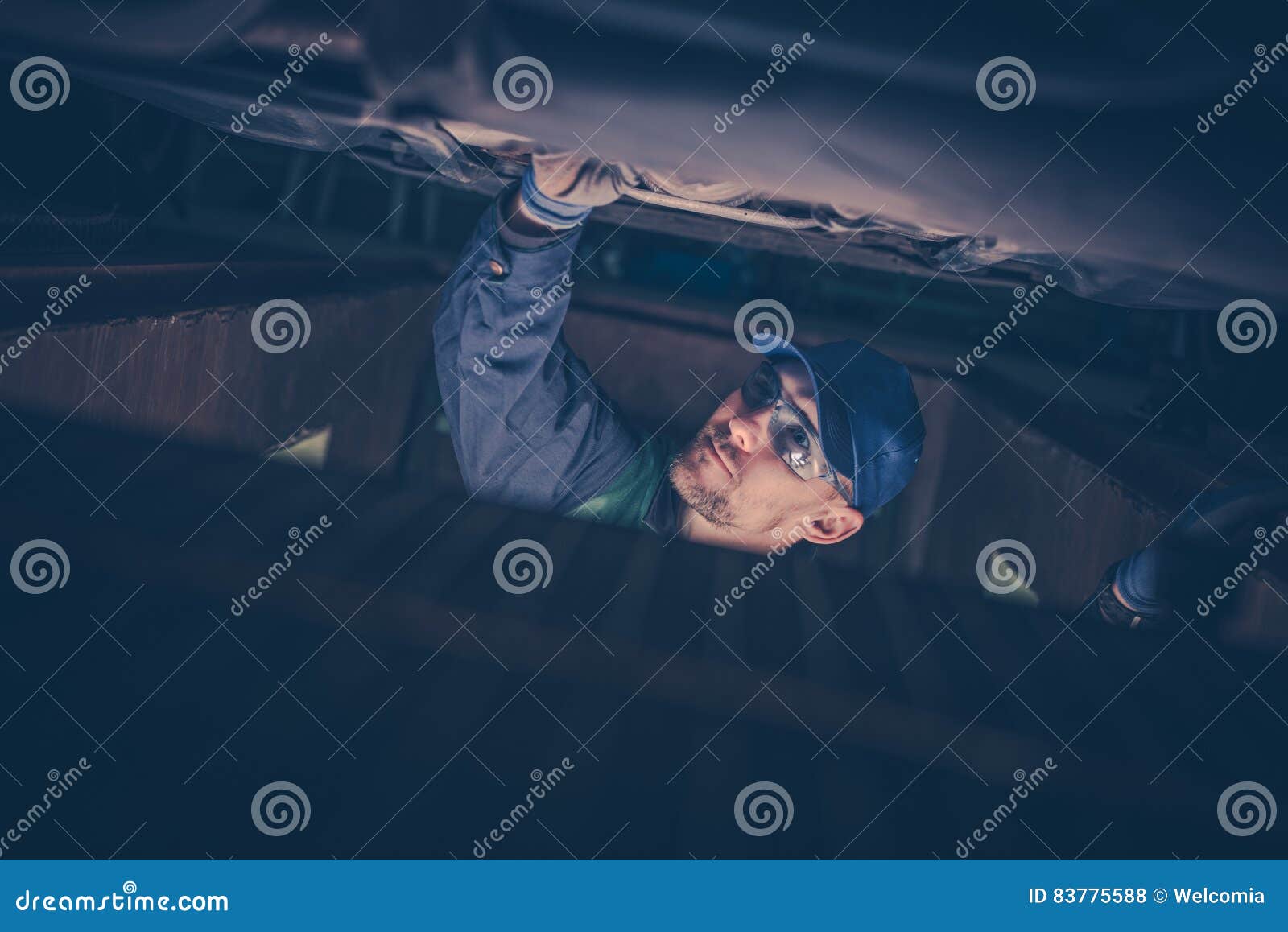 Mechanic Under the Car stock photo. Image of extreme - 83775588