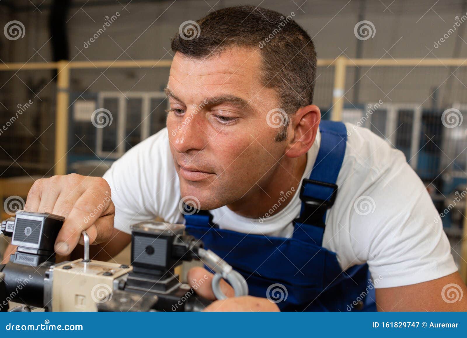 Mechanic using allen key stock image. Image of metal - 161829747