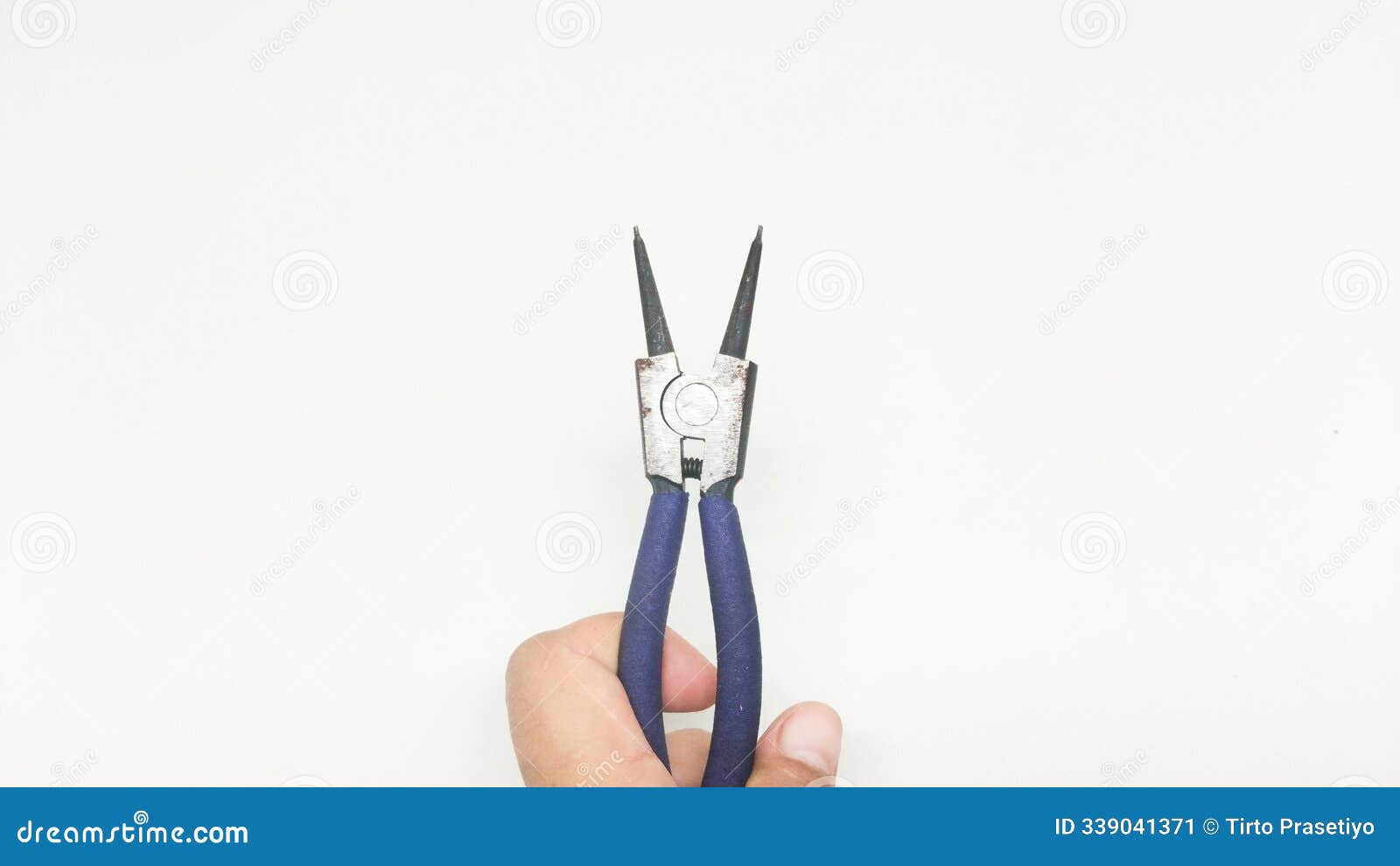 A Mechanic is Using a Blue-handled Circlip Pliers To Remove a Piston ...