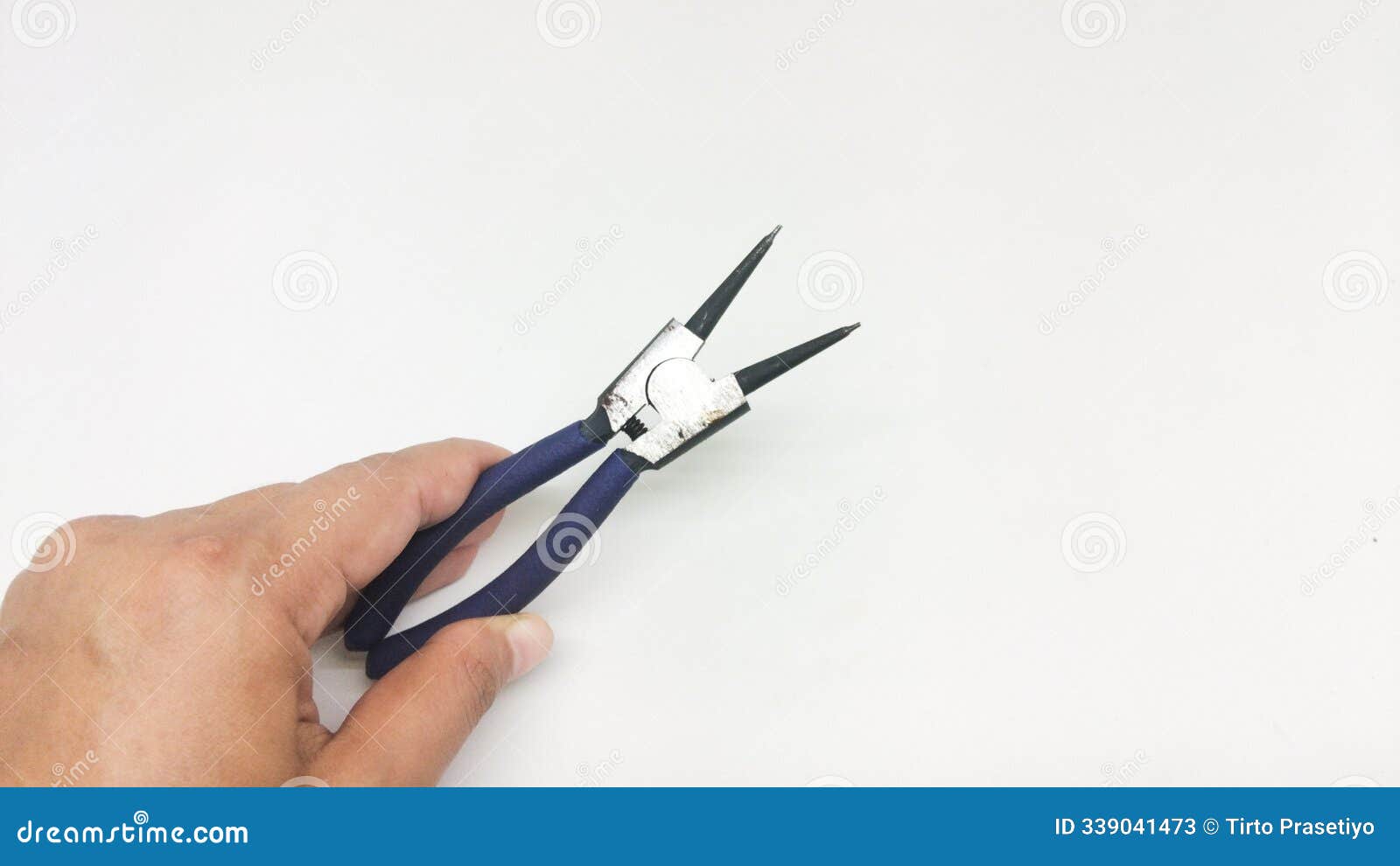 A Mechanic is Using a Blue-handled Circlip Pliers To Remove a Piston ...