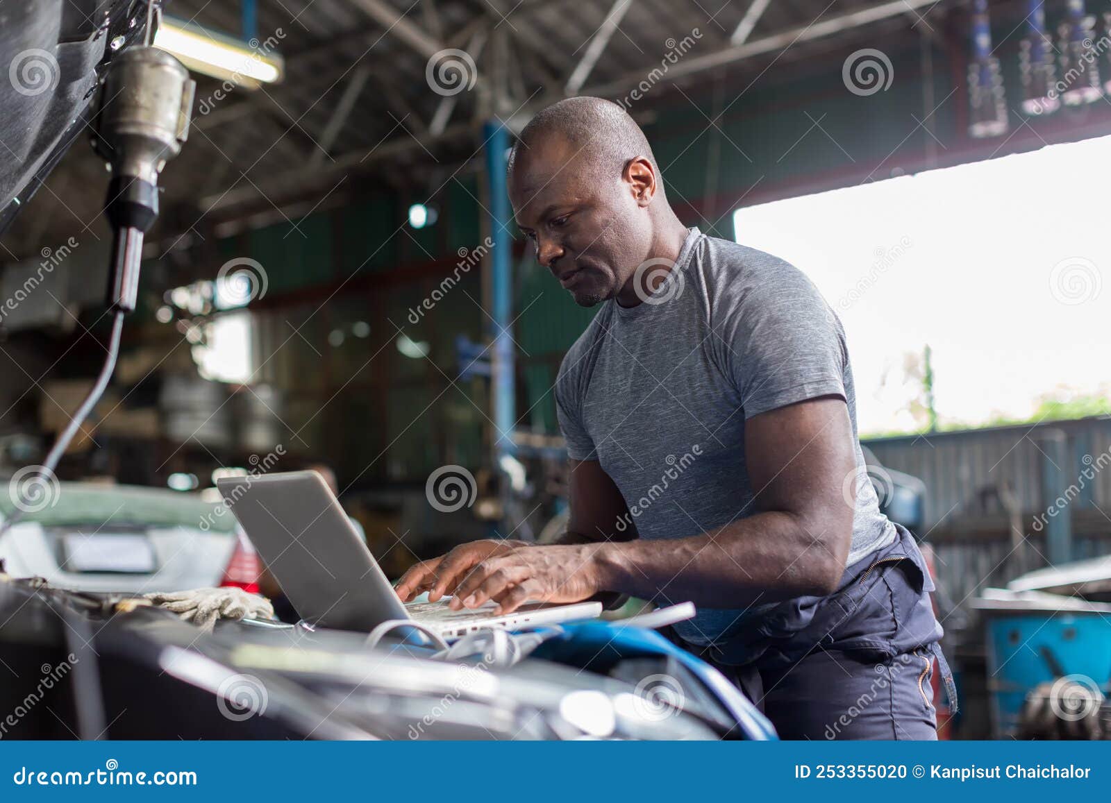 Mechanic Using Compute for Diagnostic Machine Tools Ready To Be Used ...