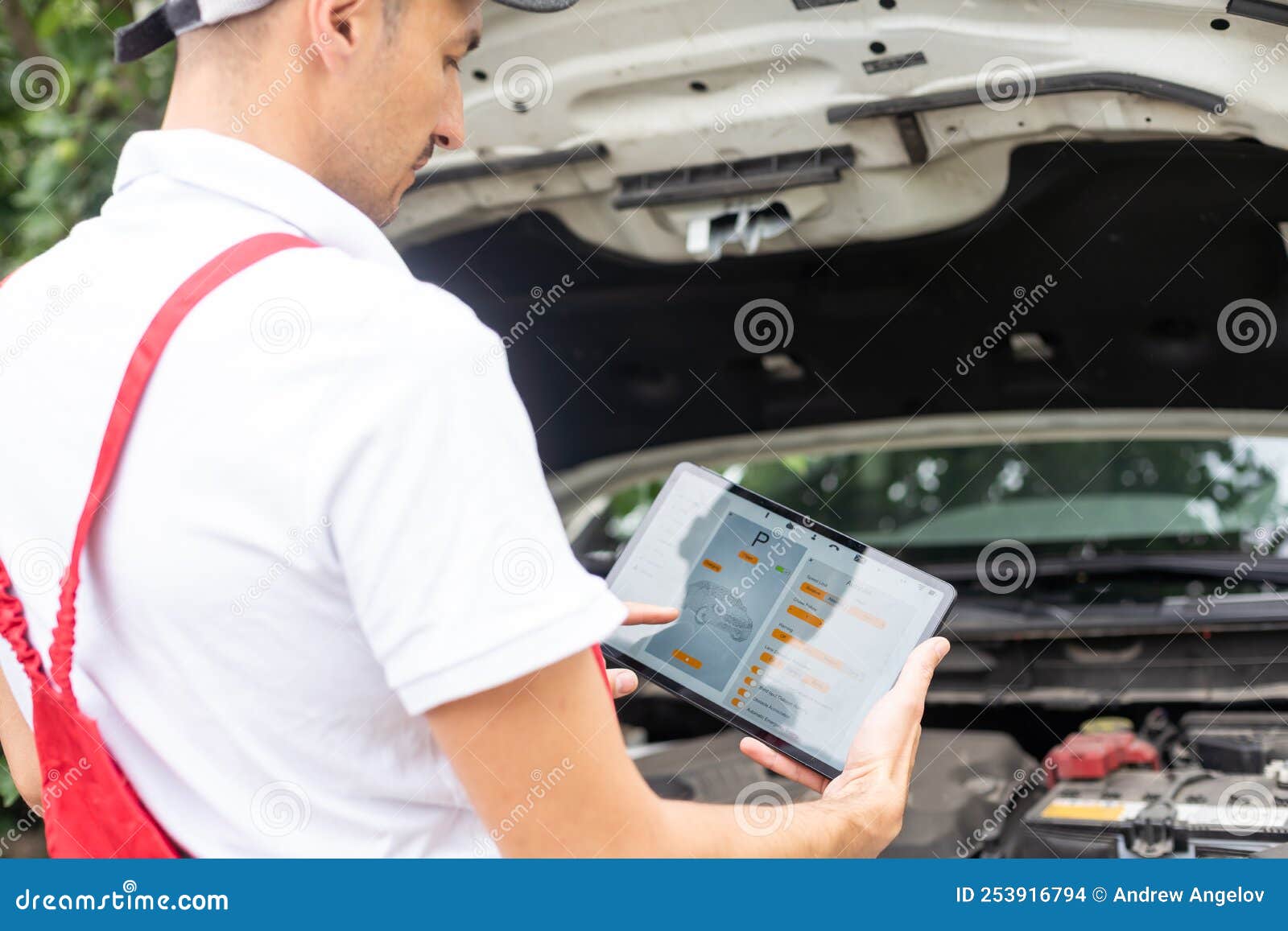 Mechanic Using Digital Tablet in Workshop Stock Photo - Image of soccer ...
