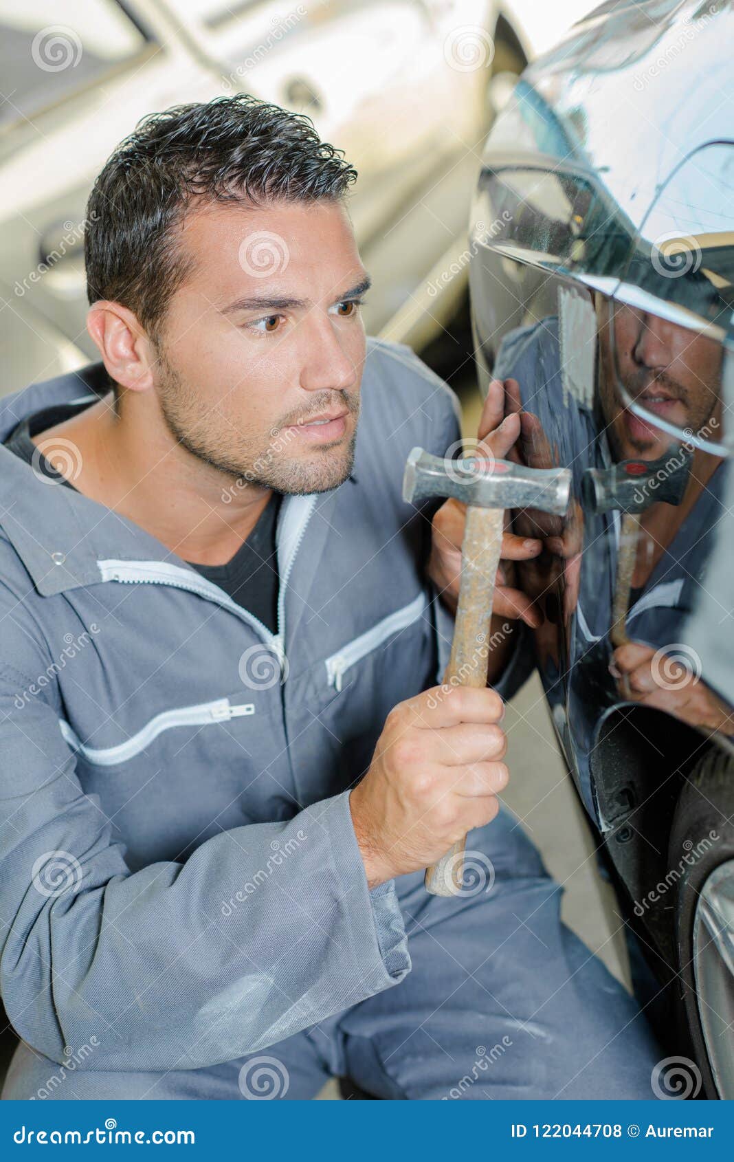 Mechanic using a hammer stock photo. Image of grunge - 122044708