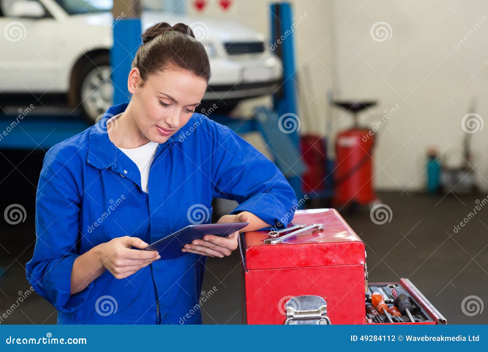 Mechanic Using Her Tablet Pc Stock Photo - Image of mechanic, expertise ...
