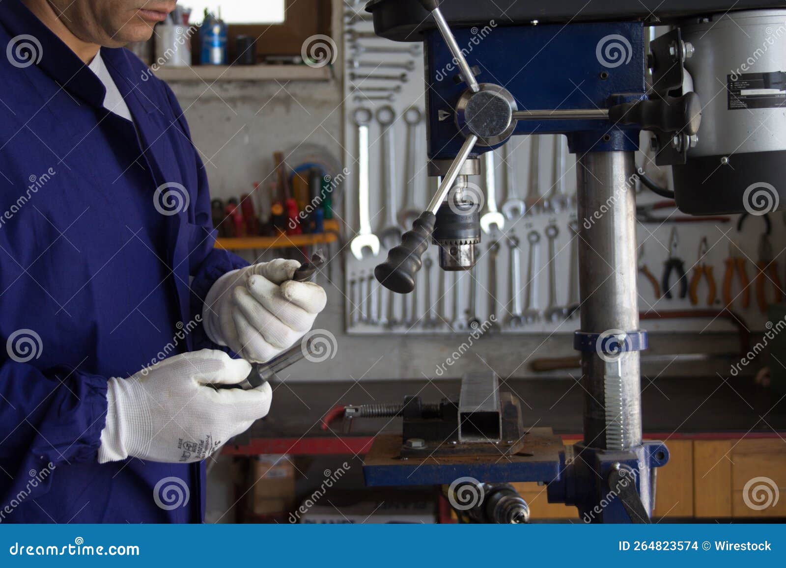 Mechanic Using Industrial Machine in the Workshop Stock Photo - Image ...