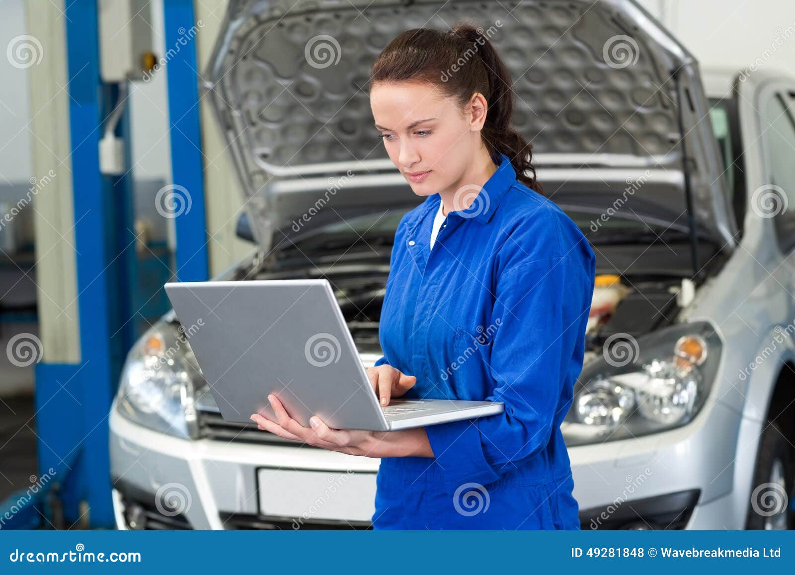 Mechanic Using Laptop on Car Stock Photo - Image of wireless, blue ...