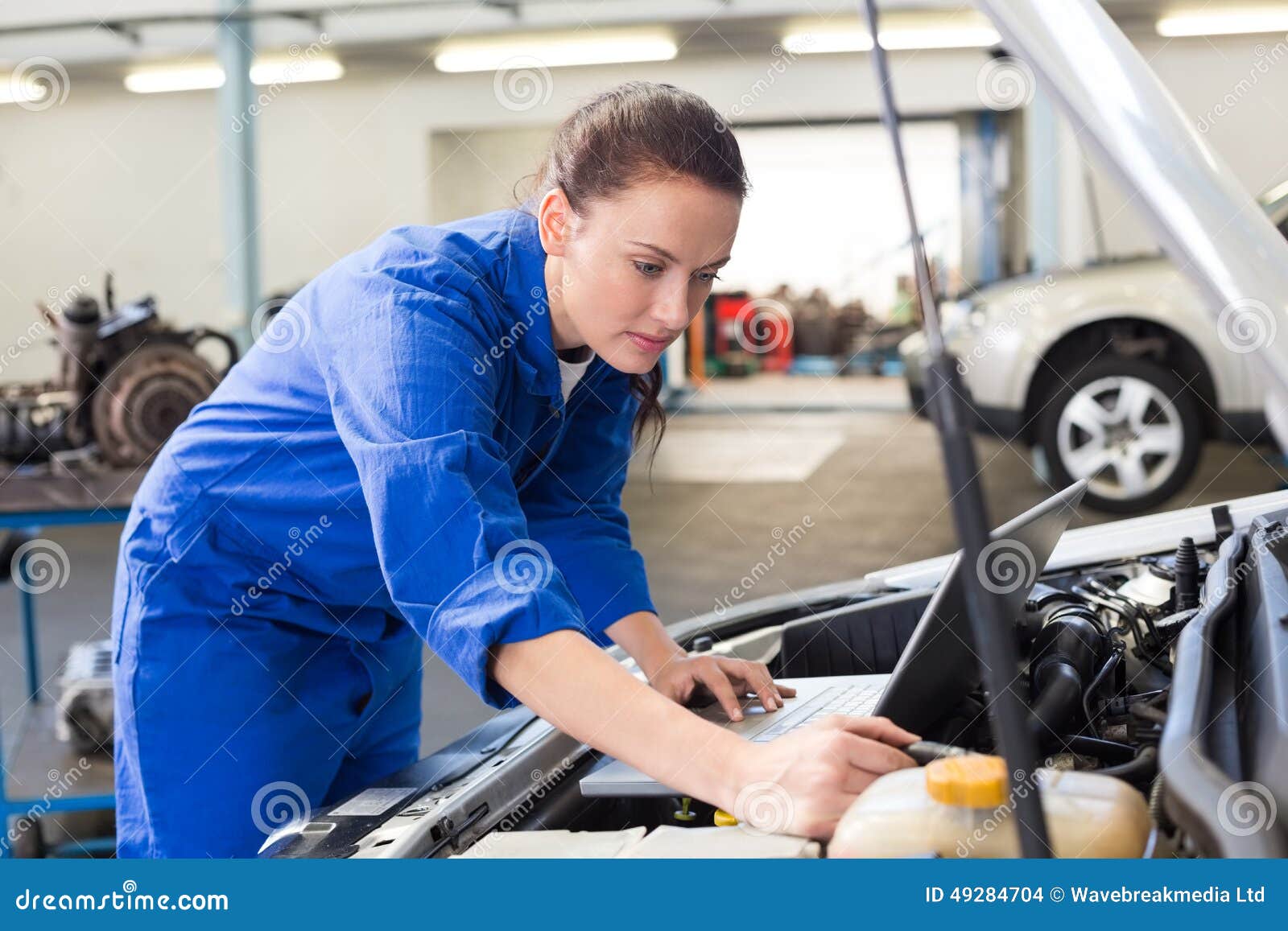Mechanic Using Laptop on Car Stock Photo - Image of engineer, mechanic ...