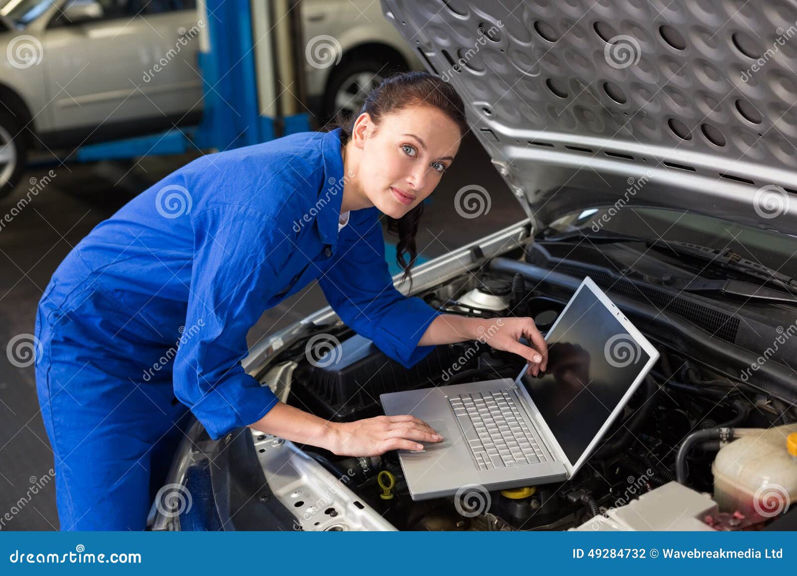 Mechanic Using Laptop on Car Stock Photo - Image of manual, indoors ...