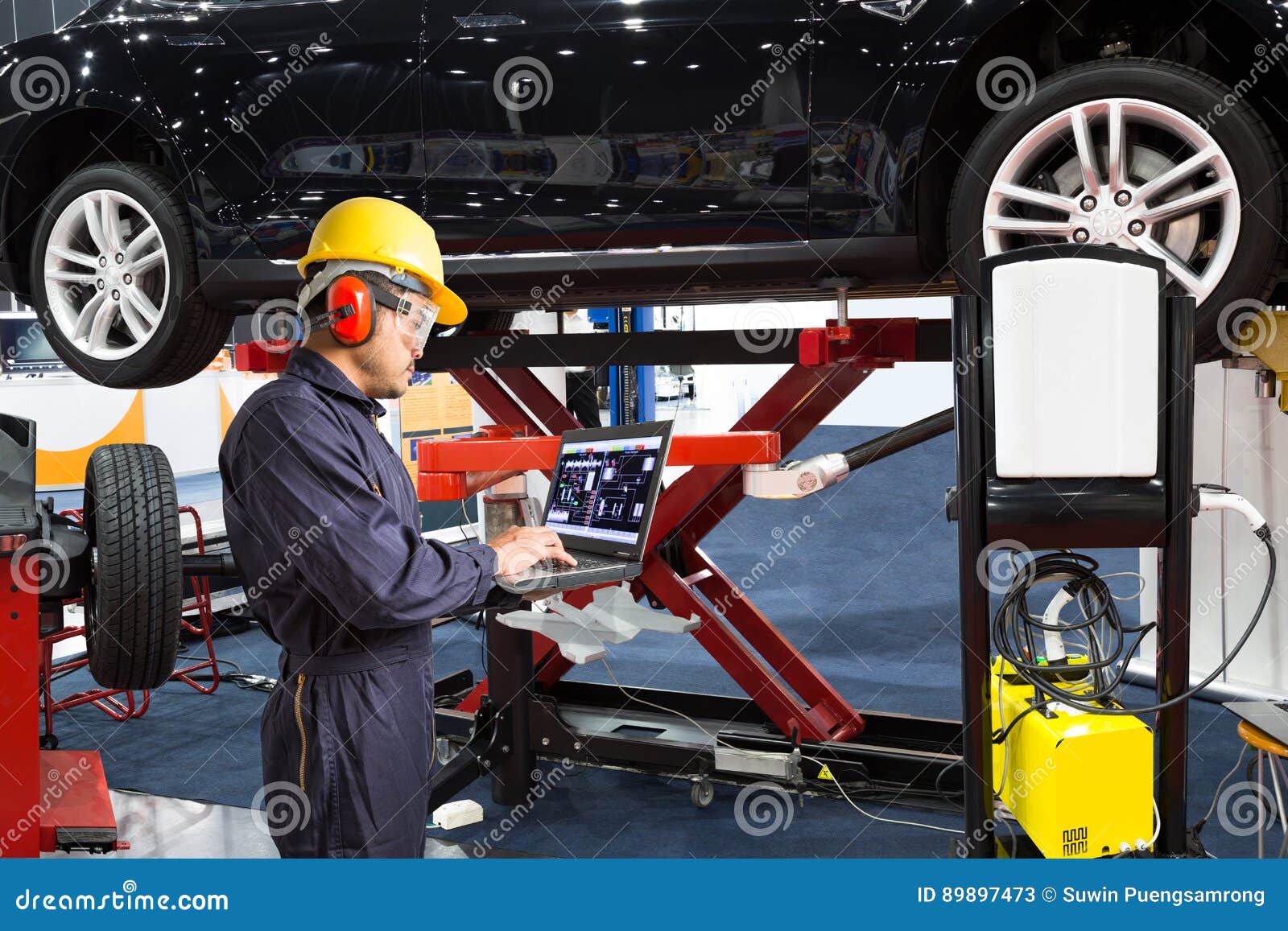 Mechanic Using Laptop Computer for Maintenance Modern Car Stock Image ...