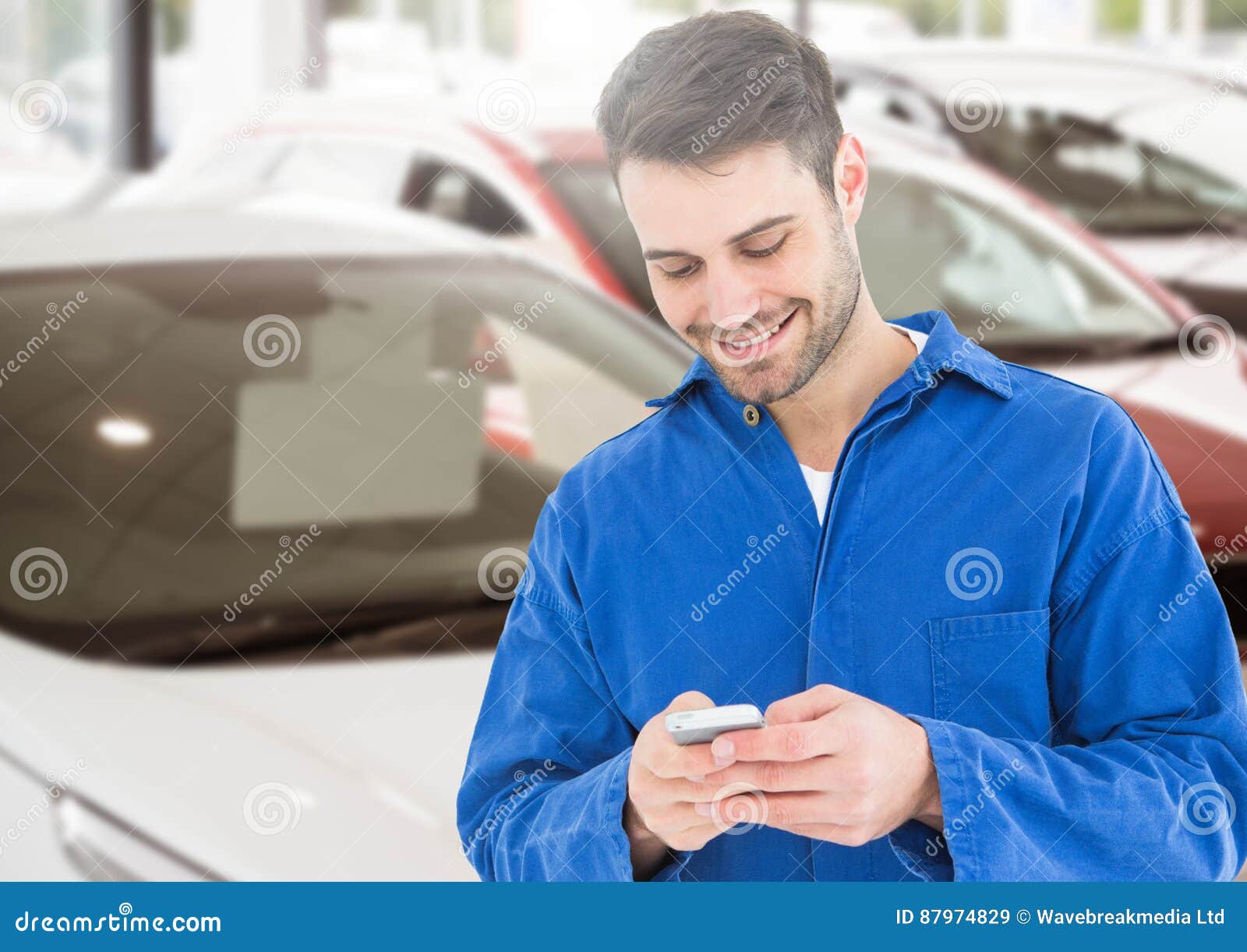 Mechanic Using Mobile Phone in Parking Lot Stock Image - Image of ...