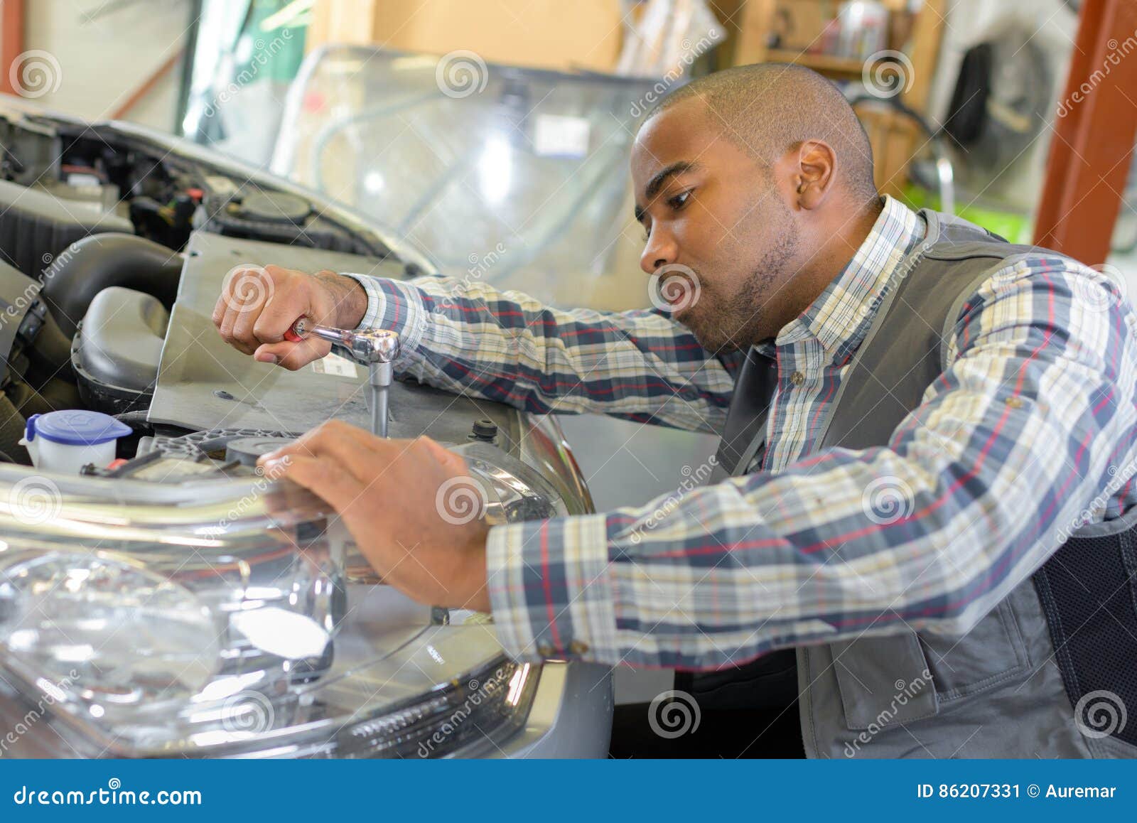 Mechanic Using Ratchet on Front Car Stock Image - Image of steel ...